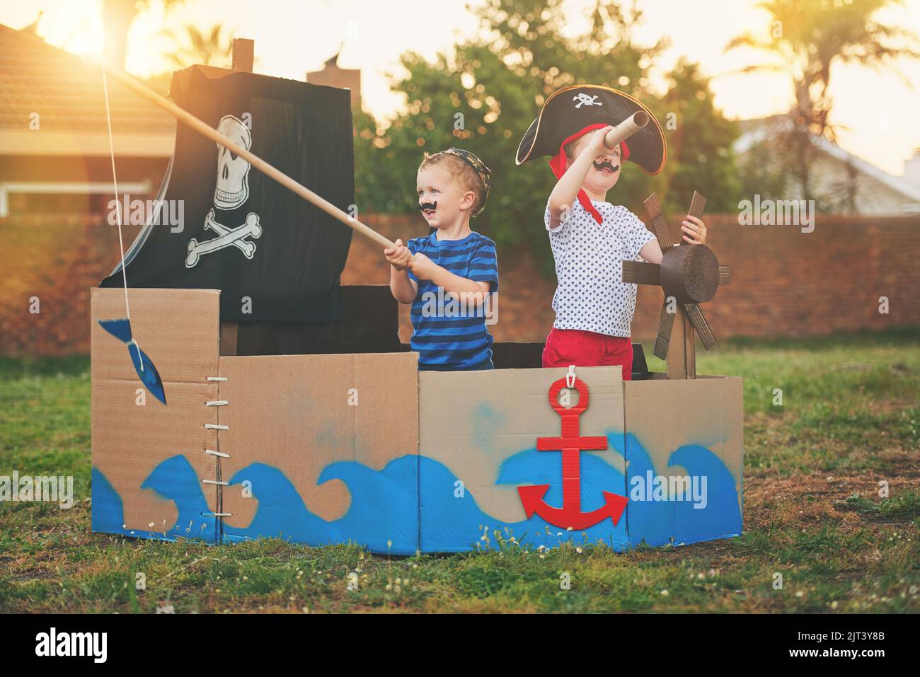 On the hunt for buried treasure. a cute little boy and his brother ...