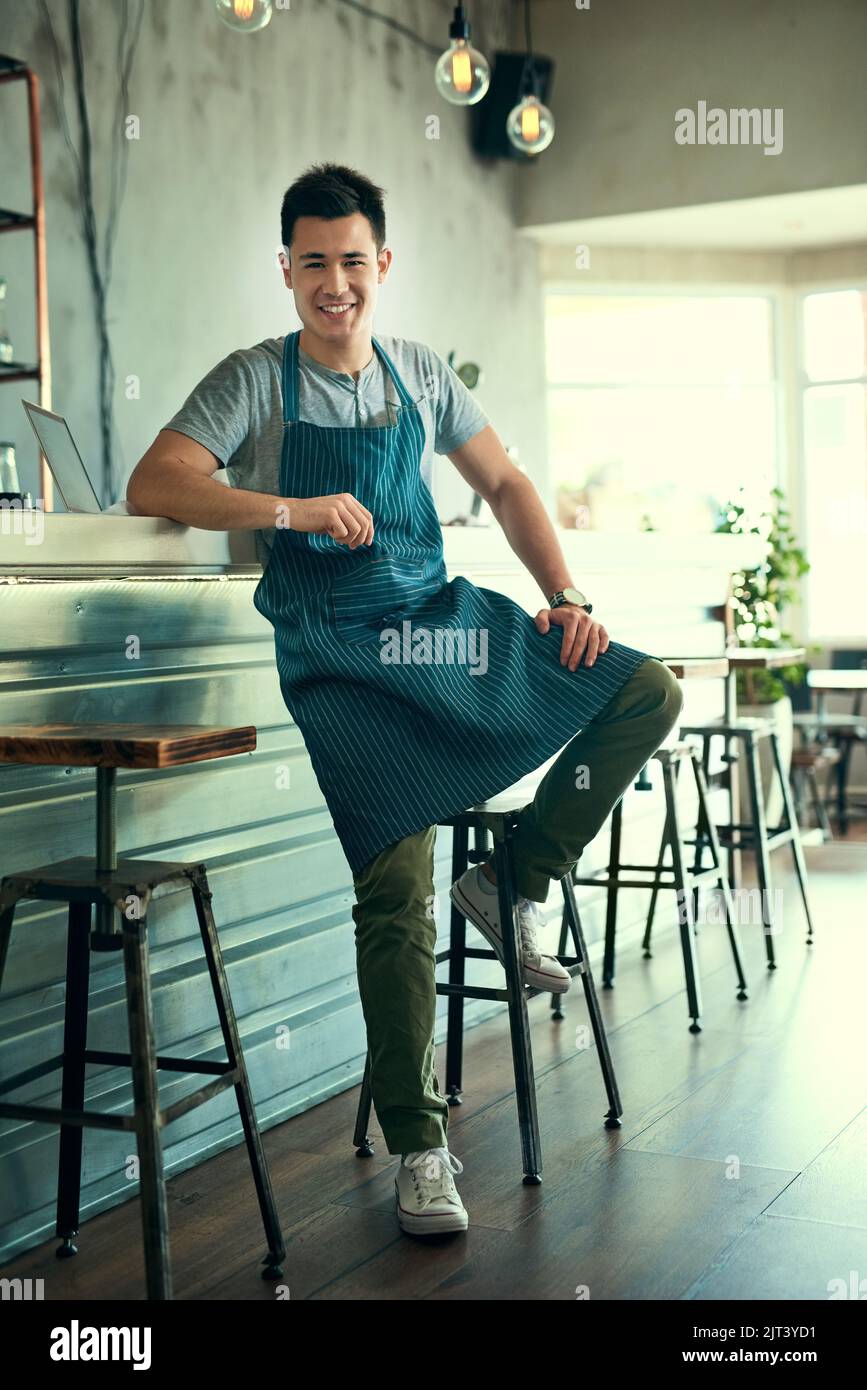 My coffee shop is sure to succeed. Full length portrait of a handsome ...