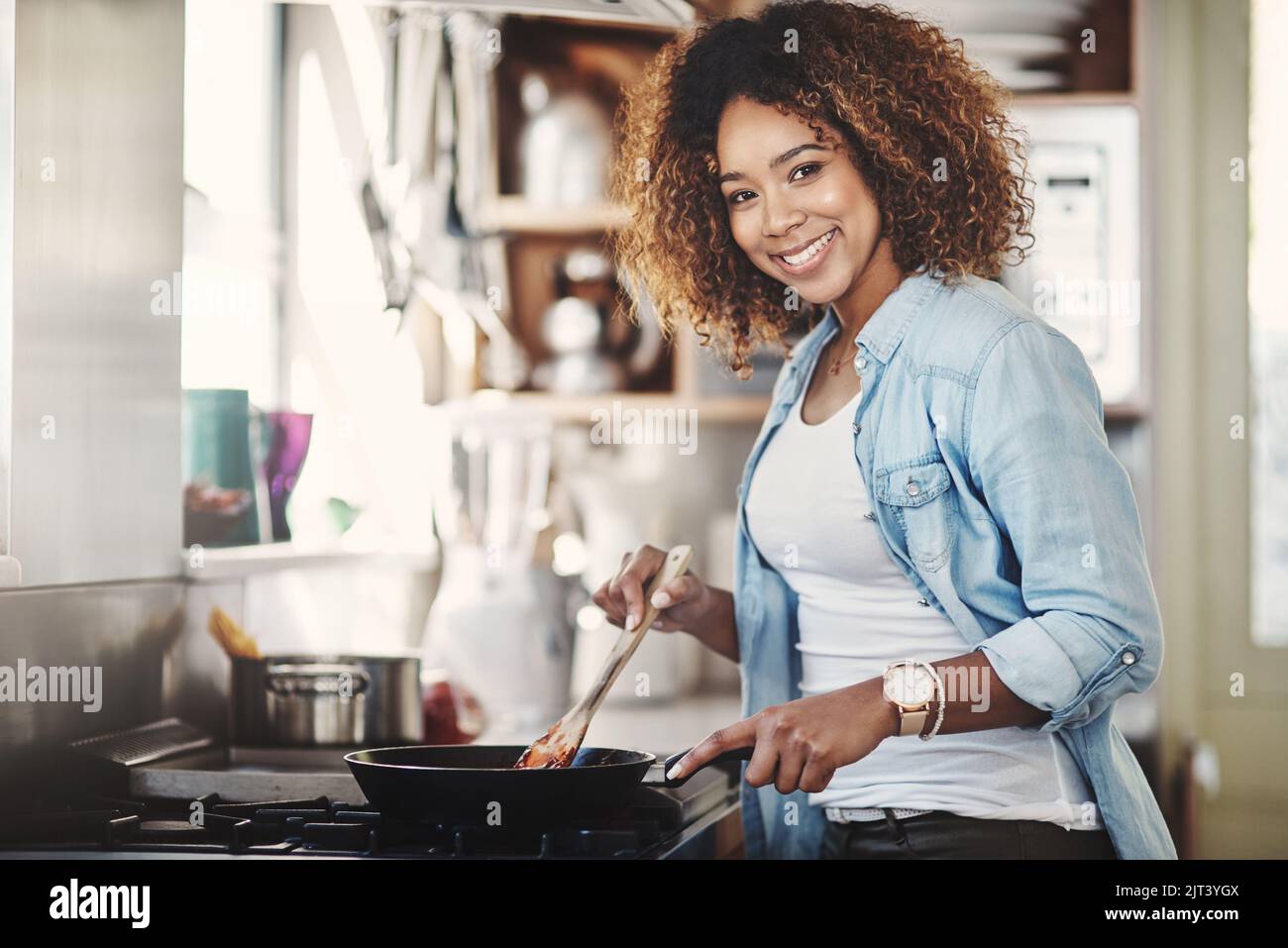African lady lady cooking hi-res stock photography and images - Alamy
