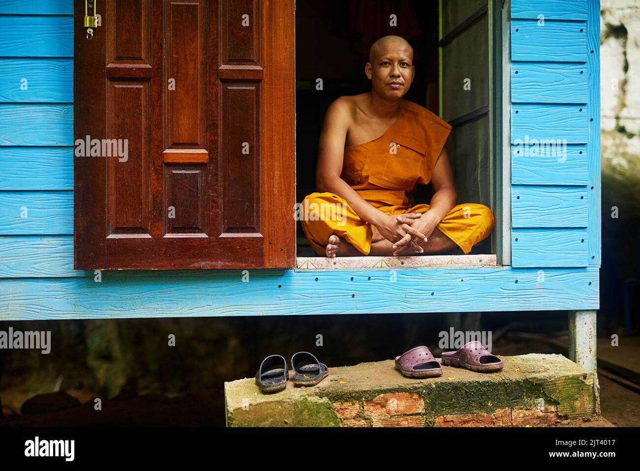 Rule your mind or it will rule you. Portrait of a buddhist monk sitting ...