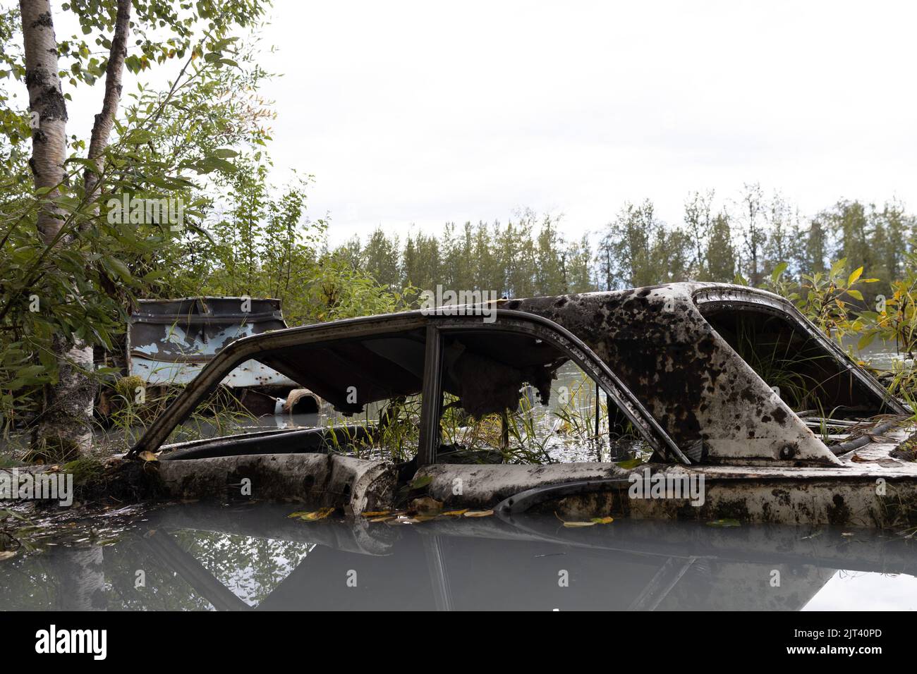 Rusted car sank in river Stock Photo - Alamy