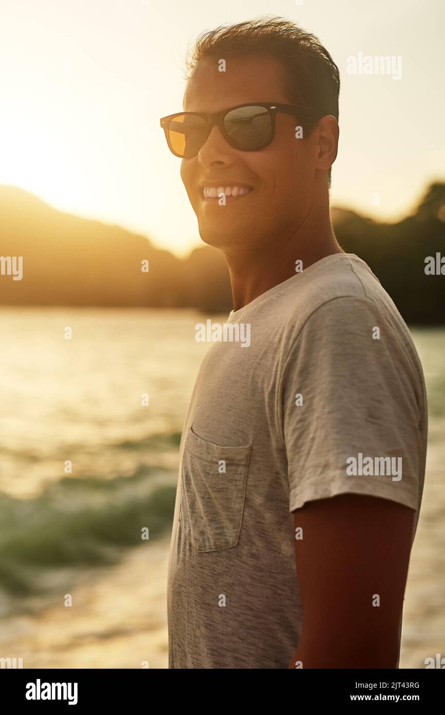 Id choose the beach over anything. Portrait of a handsome young man ...