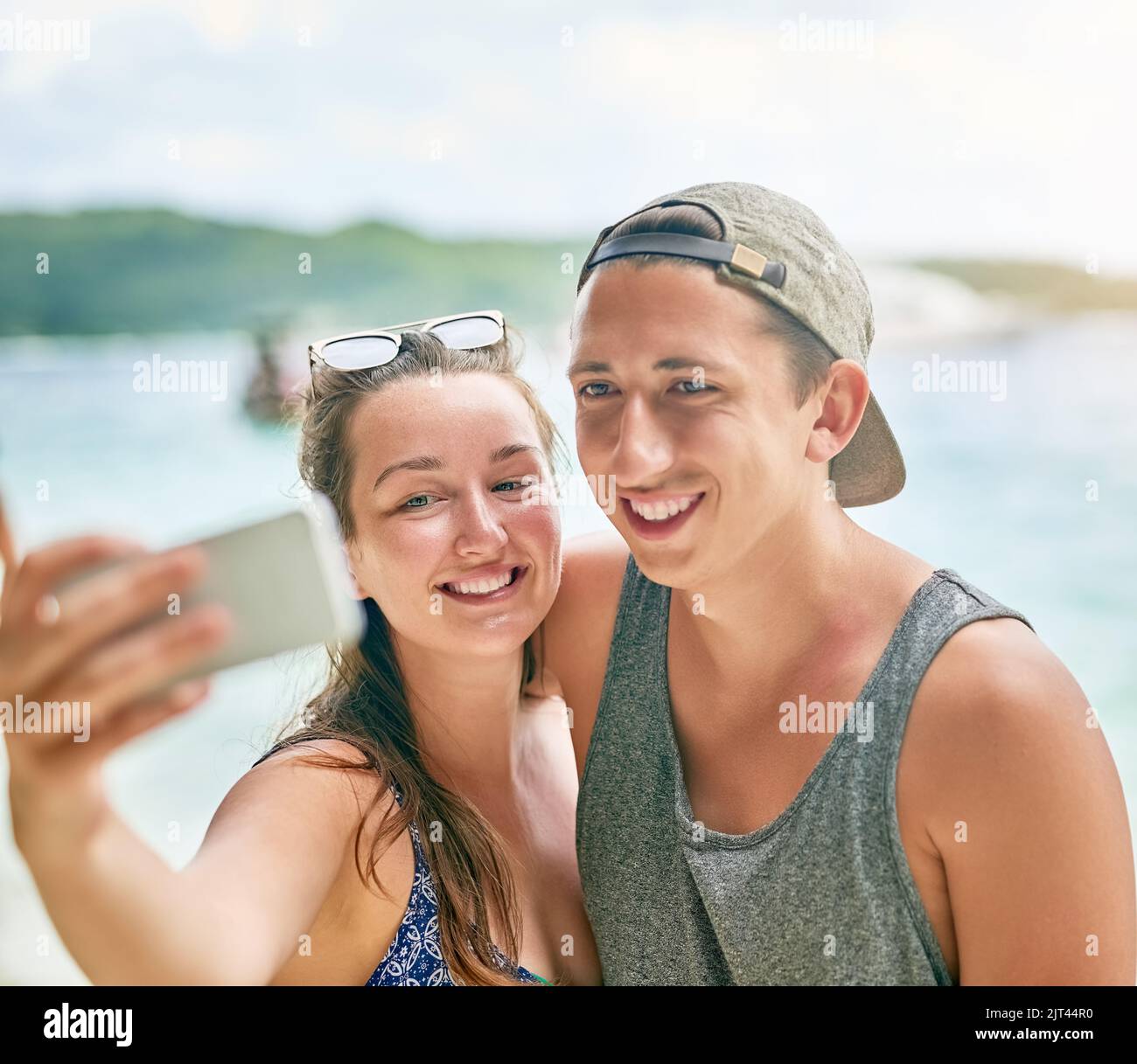 Beach Selfies Are A Must A Happy Couple Taking A Selfie On The Beach