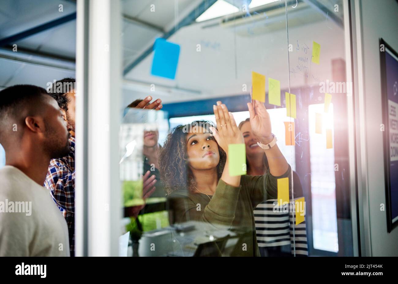 Brainstorming to inspire brilliance. colleagues having a brainstorming ...