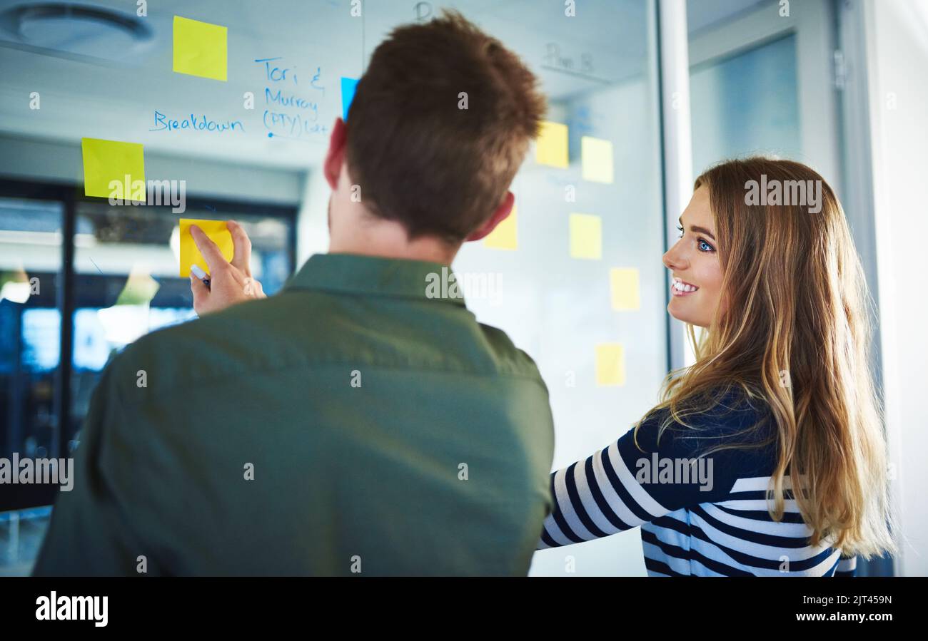 Encouraging creativity with her colleague. colleagues having a ...