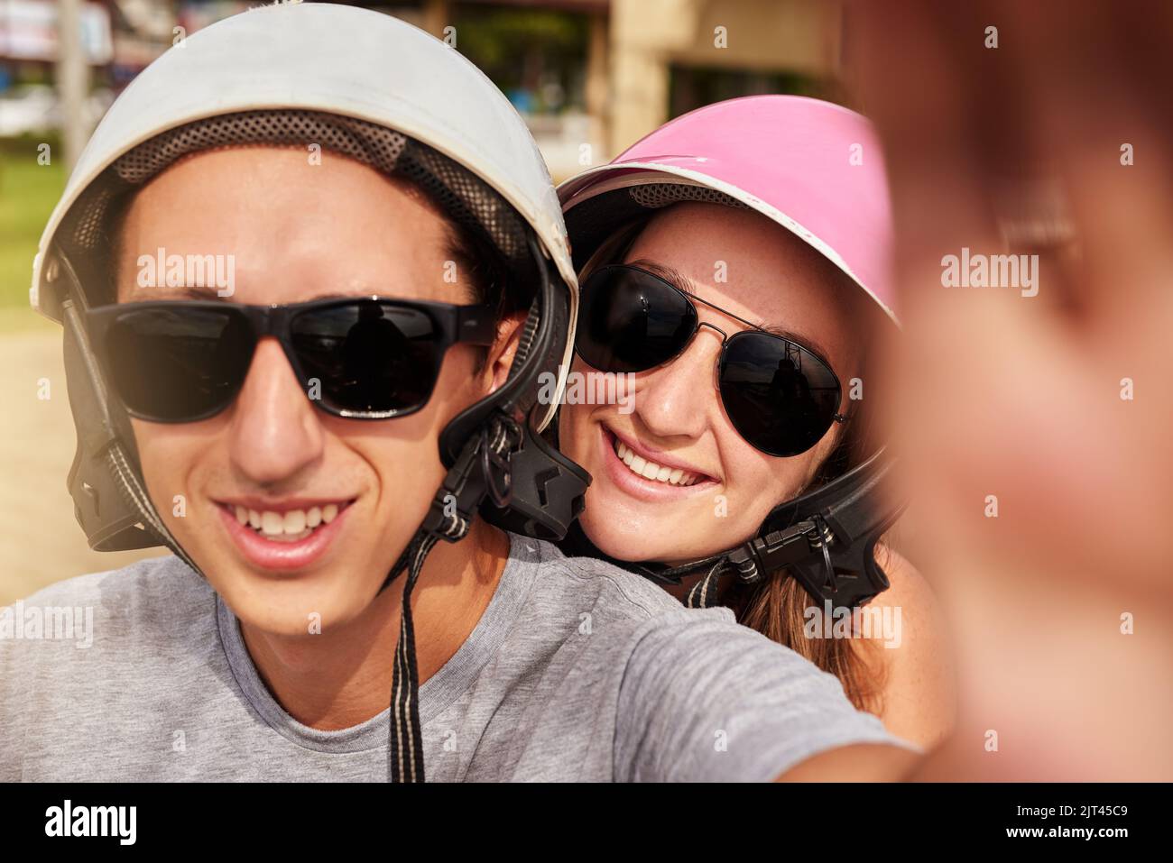 Roadtrip memories. a young couple taking a selfie together while out ...