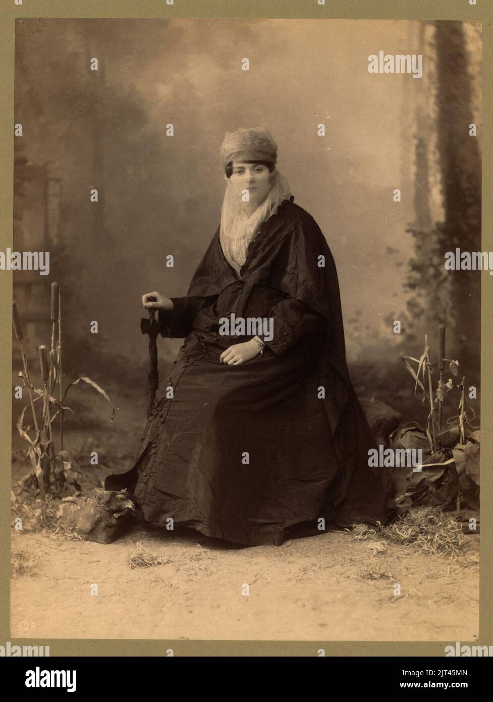 Turkish woman, full-length portrait, seated, facing front, holding ...