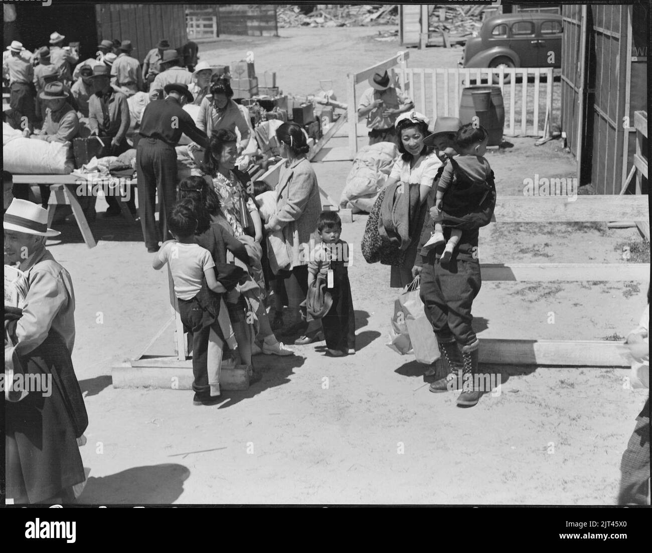 Turlock, California. These evacuees of Japanese ancestry have just ...