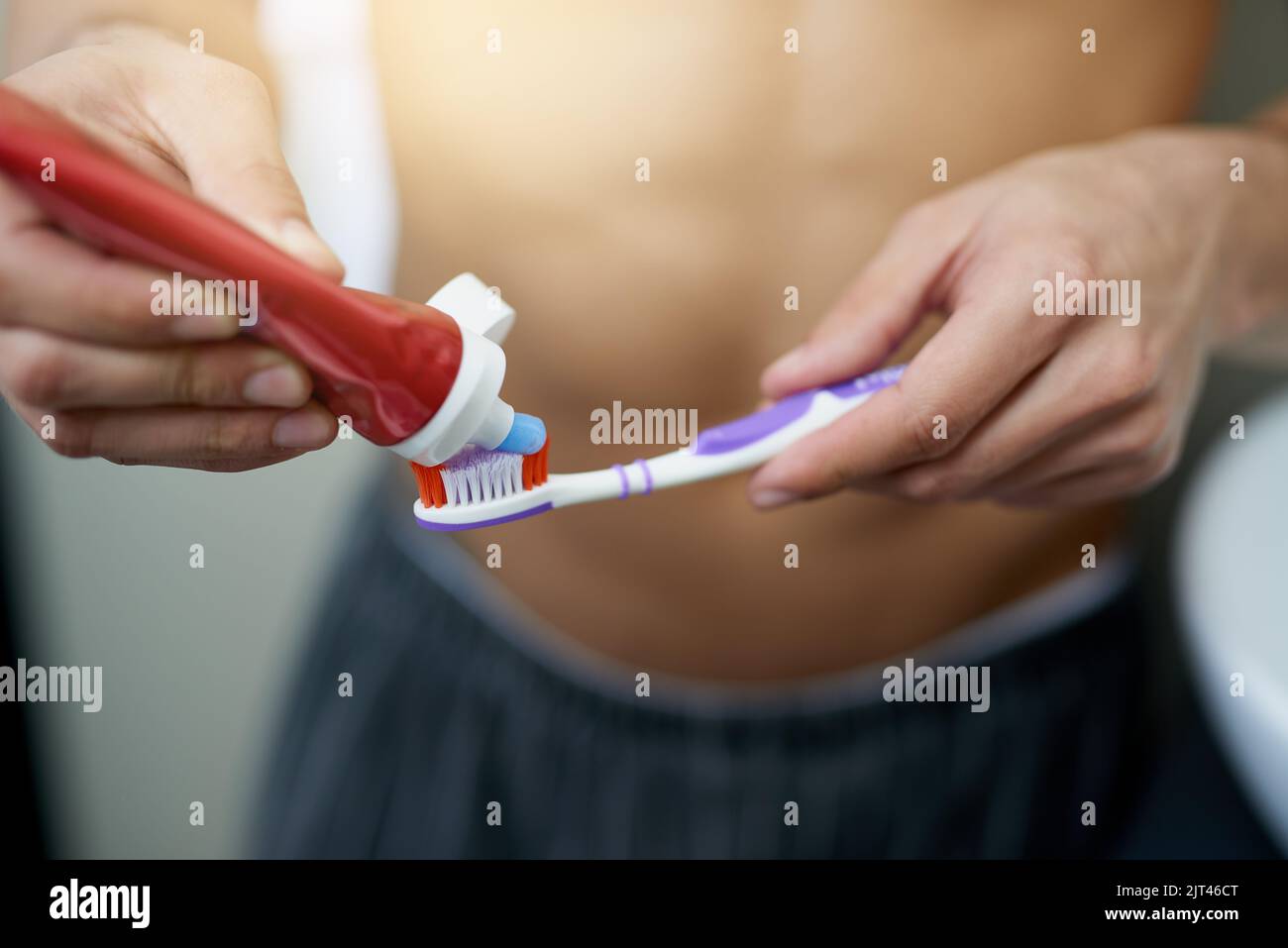 Brushing your teeth should be the first thing you do. a young man ...
