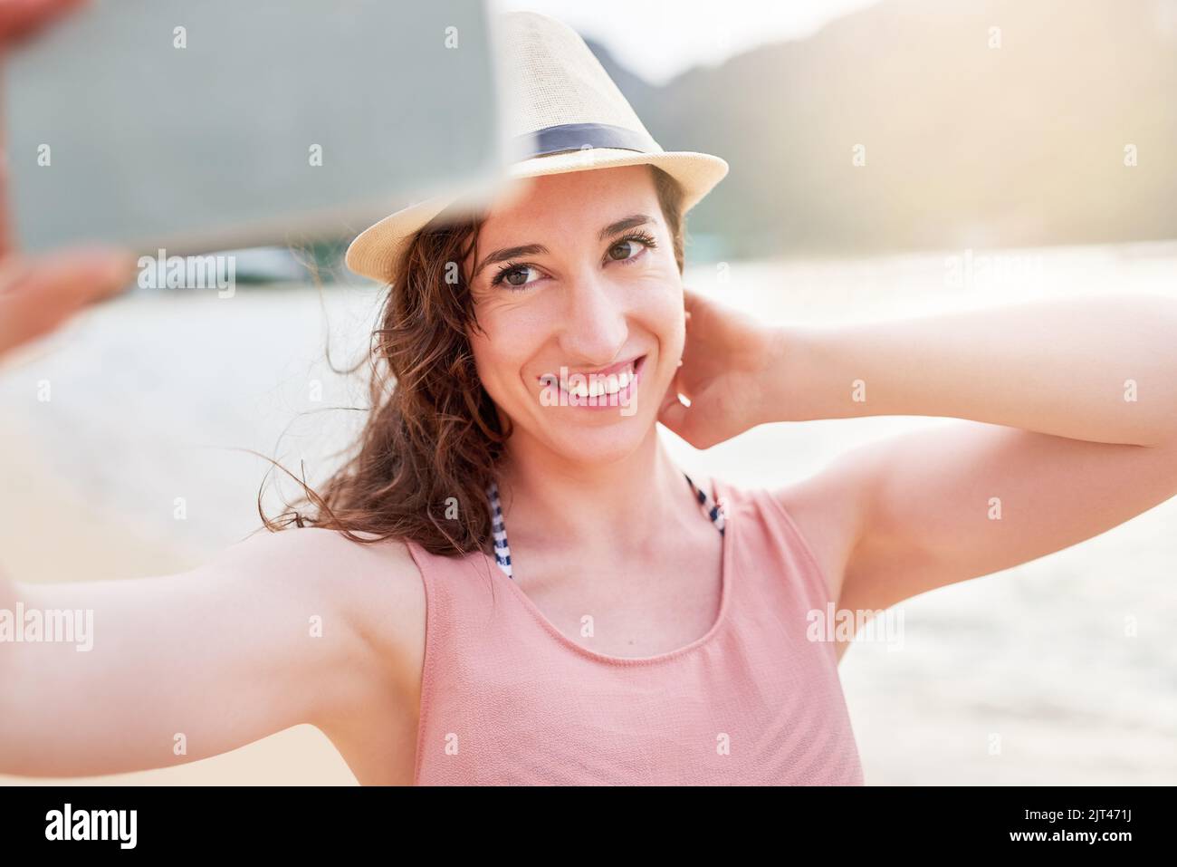Woman taking selfies on the beach hi-res stock photography and images - Alamy