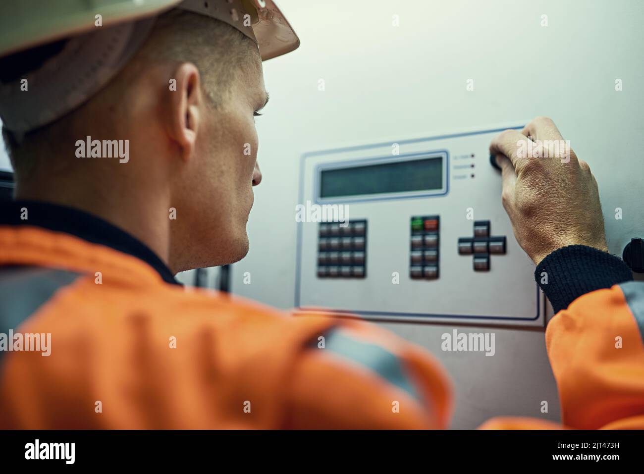 Engineering is his passion. a young engineer working with complicated ...