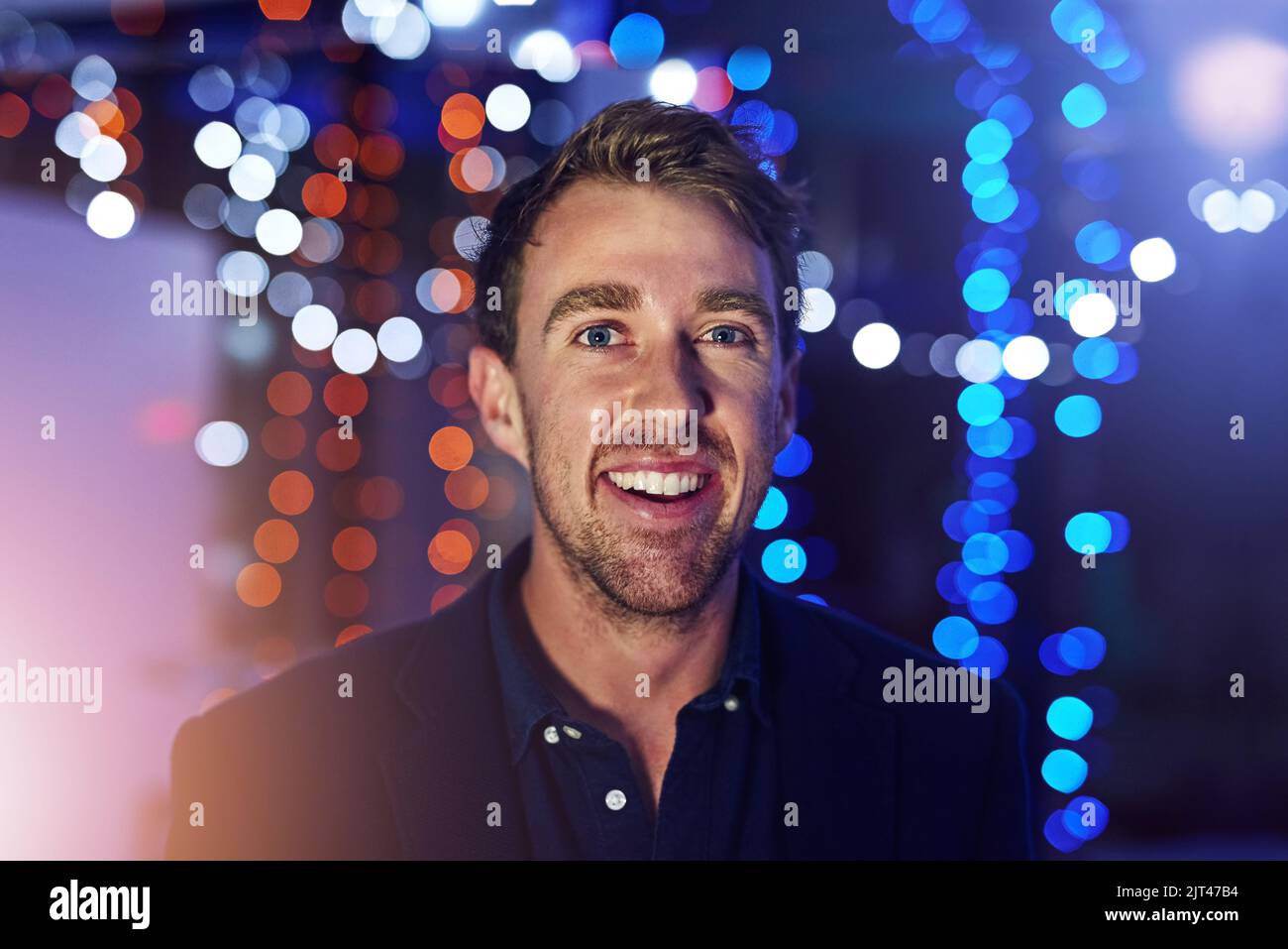 Ready to party. Portrait of a happy young man posing alone on the ...