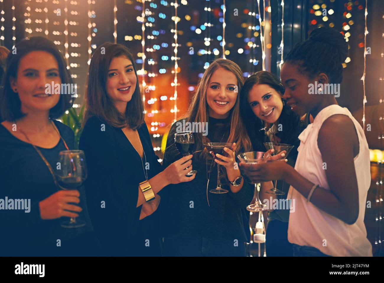 Its a night worth celebrating. Portrait of a group of happy friends ...