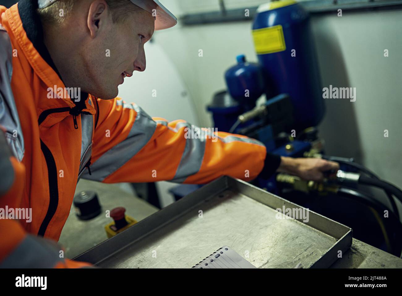 Machinery is his muse. a young engineer working with complicated ...