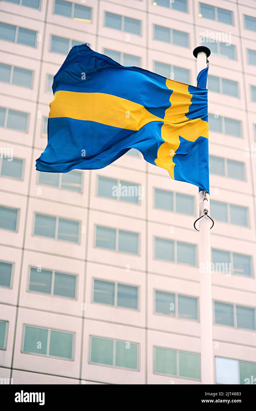 The flag of Sweden. the Swedish flag blowing in the wind Stock Photo ...