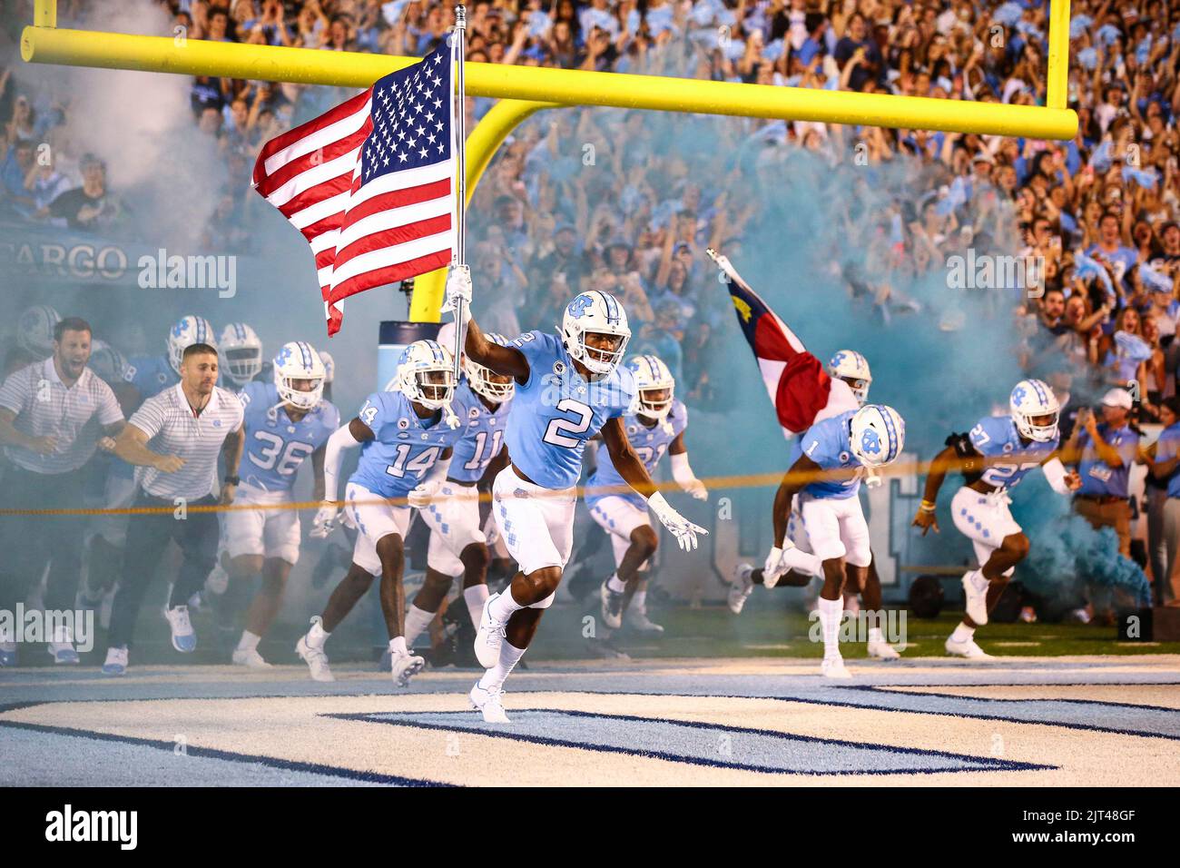 August 27,2022: North Carolina senior Don Chapman( 2) carries the flag ...