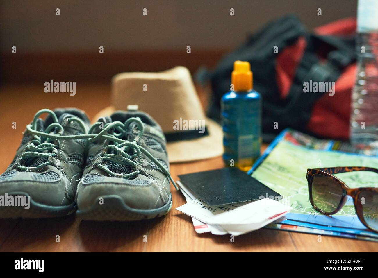 Get ready for adventure. travelling essentials on a table Stock Photo ...