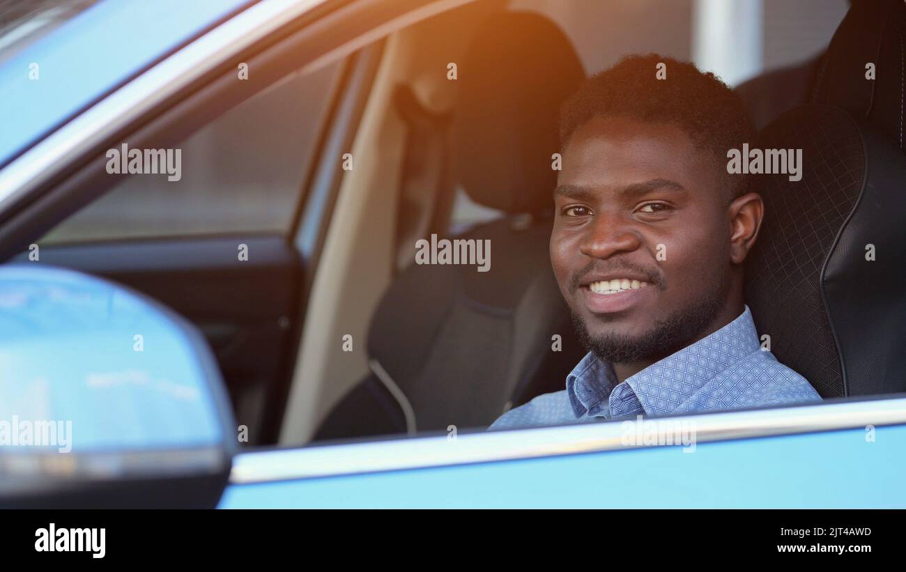 African american driver sits in hi-res stock photography and images - Alamy