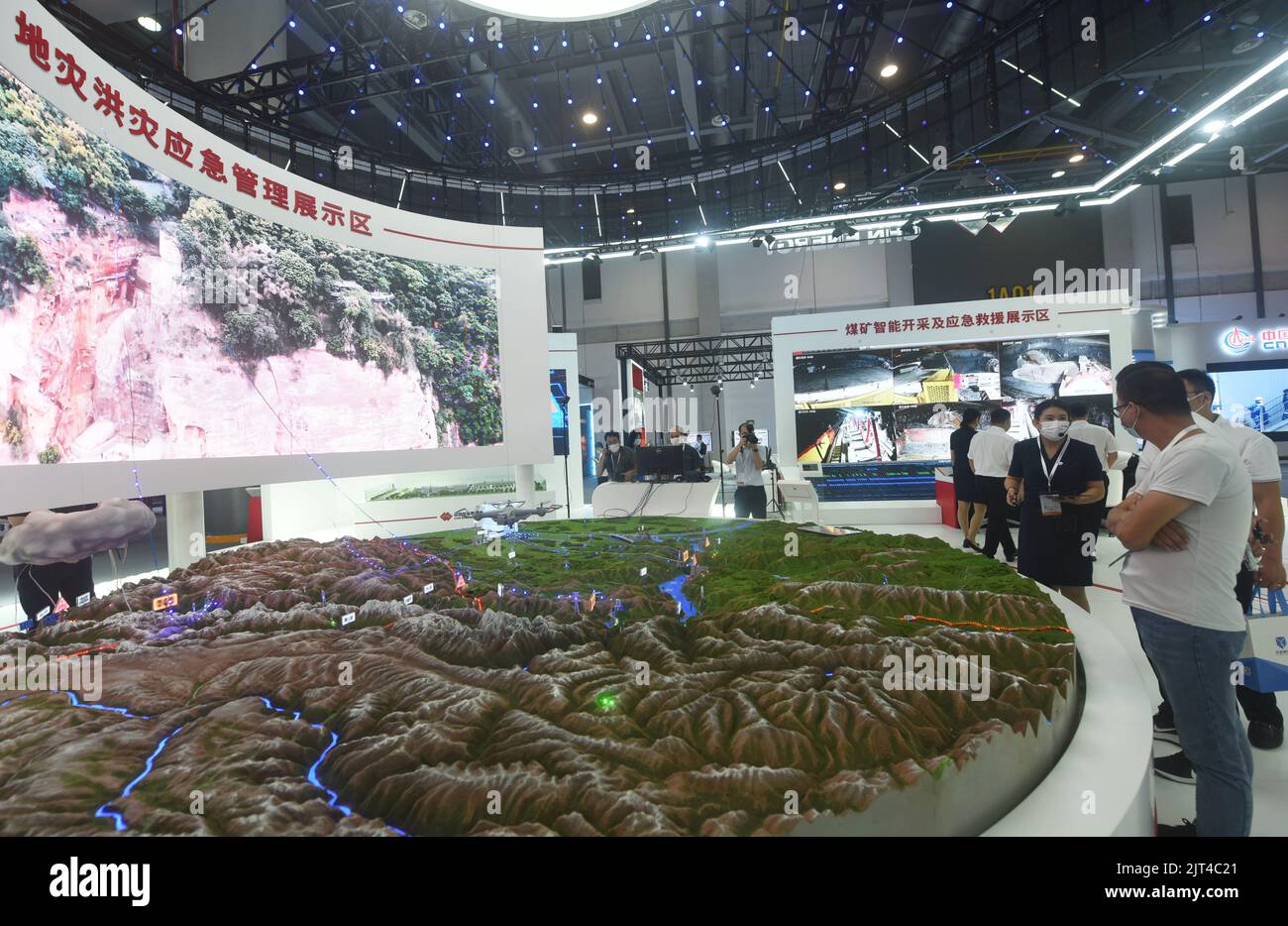 HANGZHOU, CHINA - AUGUST 28, 2022 - Visitors look at a demonstration ...