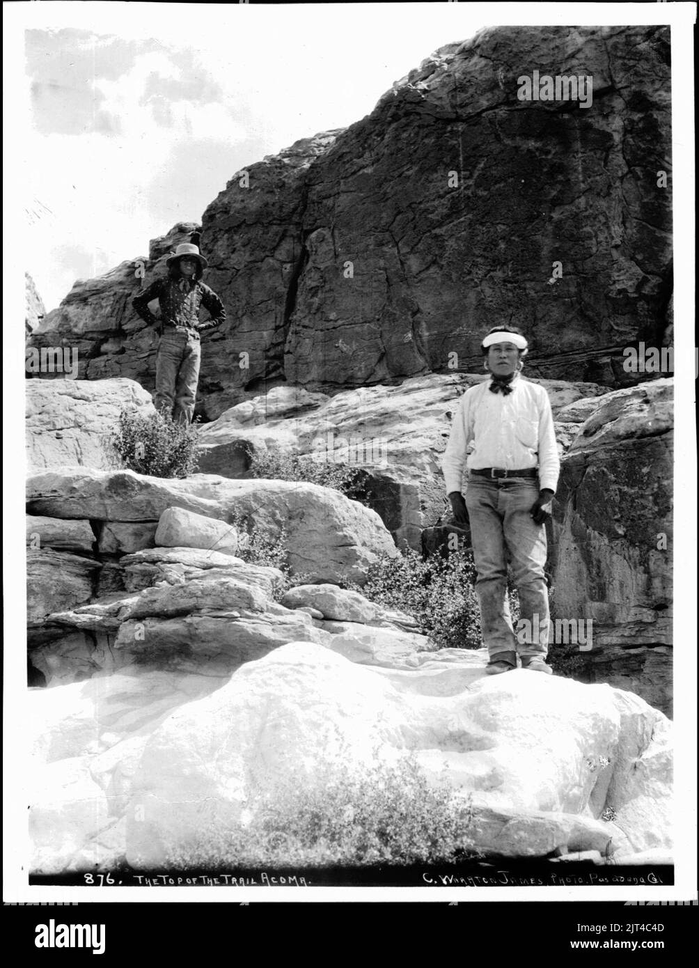 Two Acoma Indian men stand at the top of the Acoma Trail, 1886 Stock ...