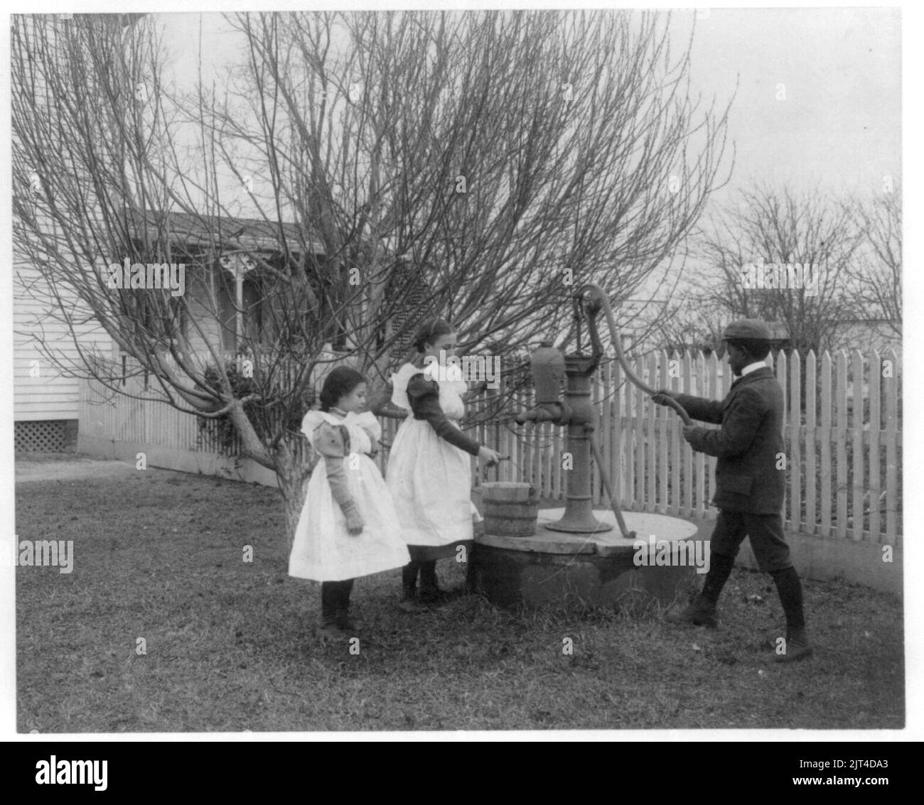Boy pumping water Cut Out Stock Images & Pictures - Alamy