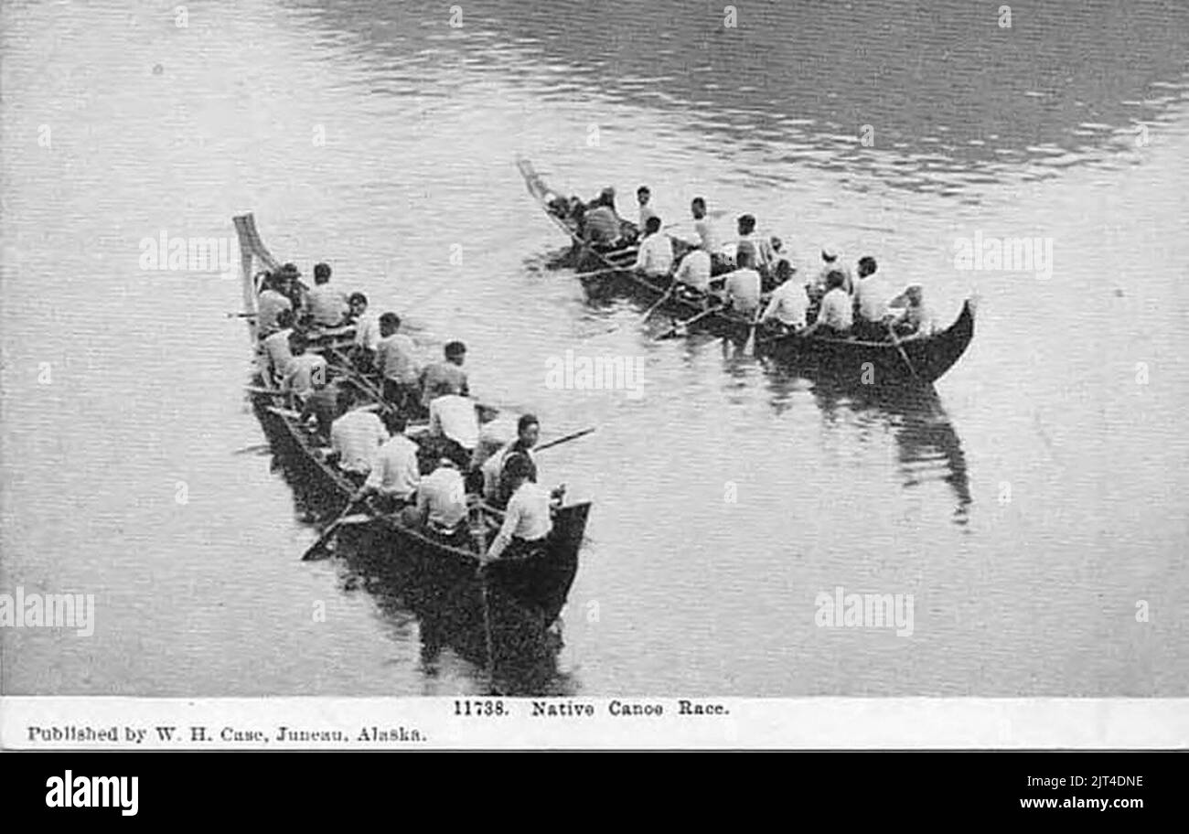 Two large canoes filled with men (probably Tlingit Indian), circa 1900 ...