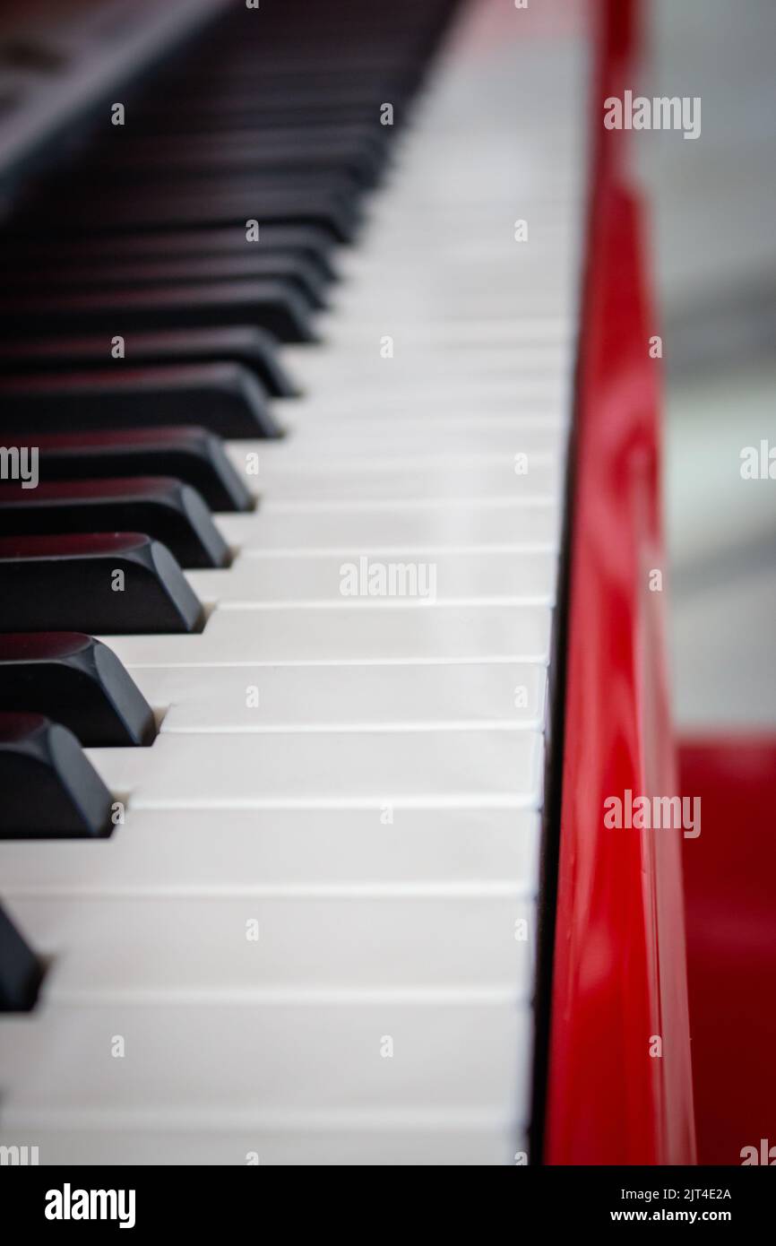 Red piano close up. Black and white piano keys. Musical background ...