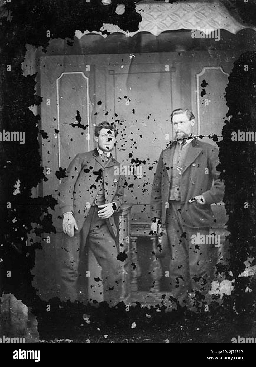 Two men standing Black and White Stock Photos & Images - Alamy