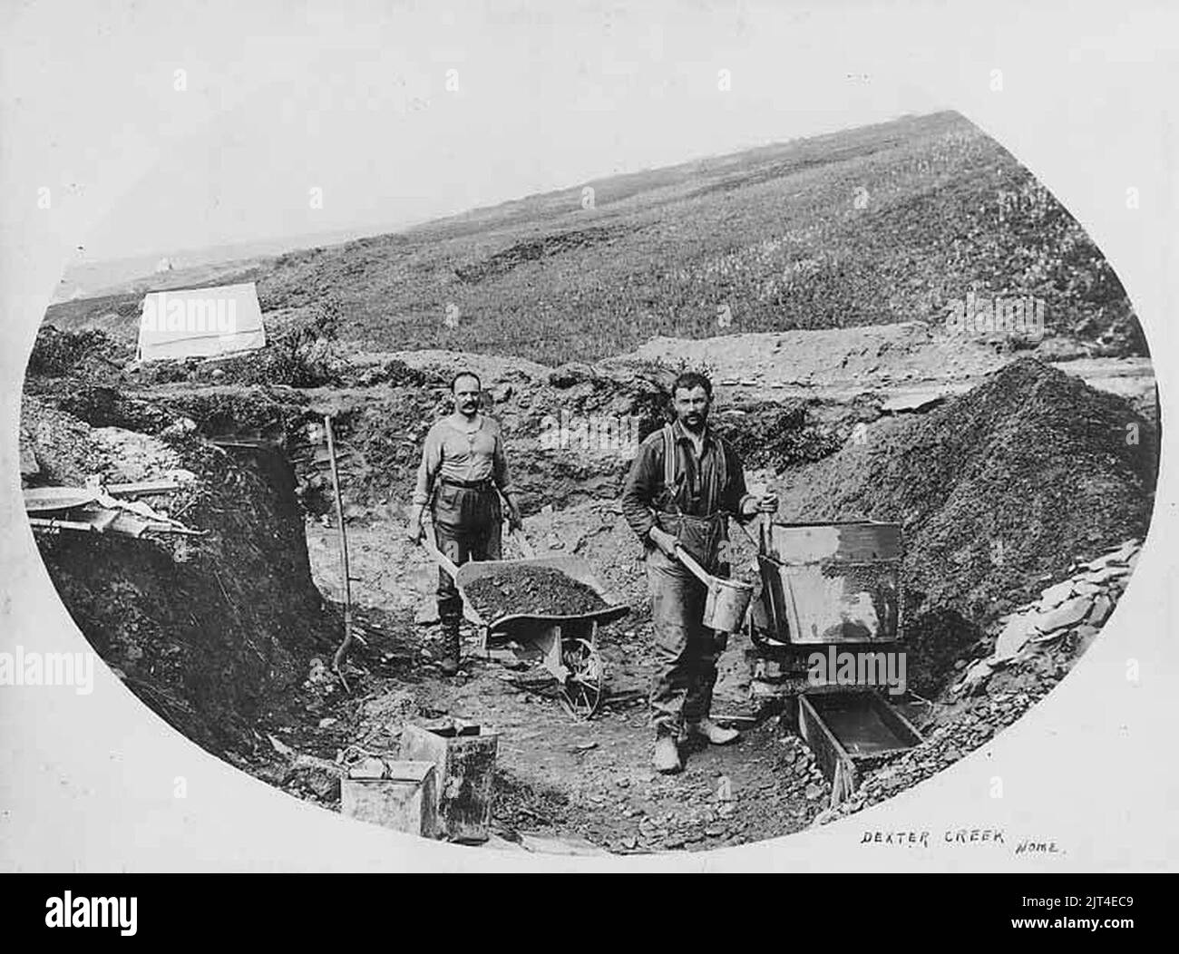 Two miners with rocker and wheel barrow at Dexter Creek, near Nome ...