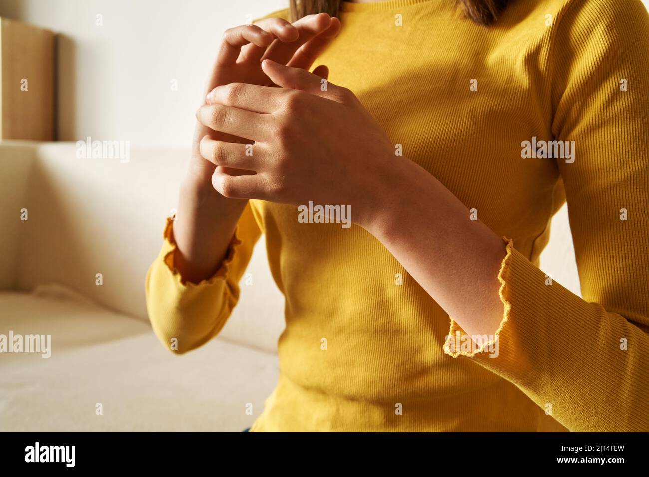 Teenage girl practicing EFT tapping or emotional freedom technique on ...