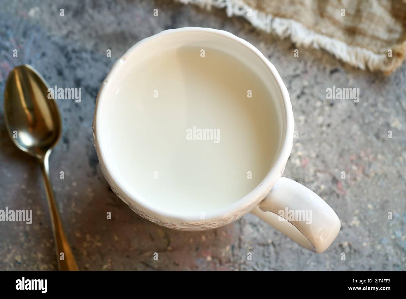 A cup of dairy kefir in a ceramic cup, top view. Source of probiotics ...