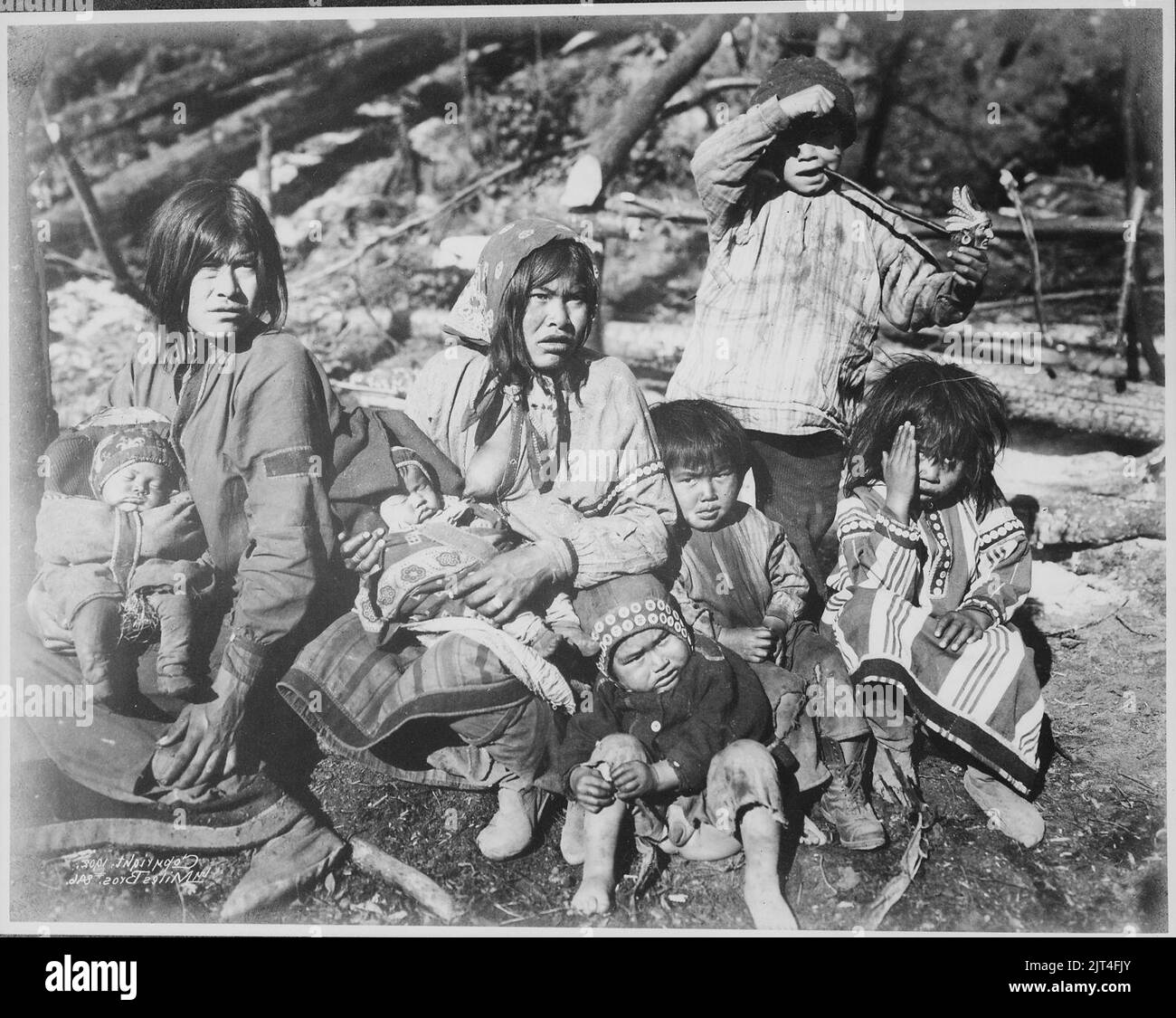 Two Tlingit women with several children near the Kotsina River, Alaska ...