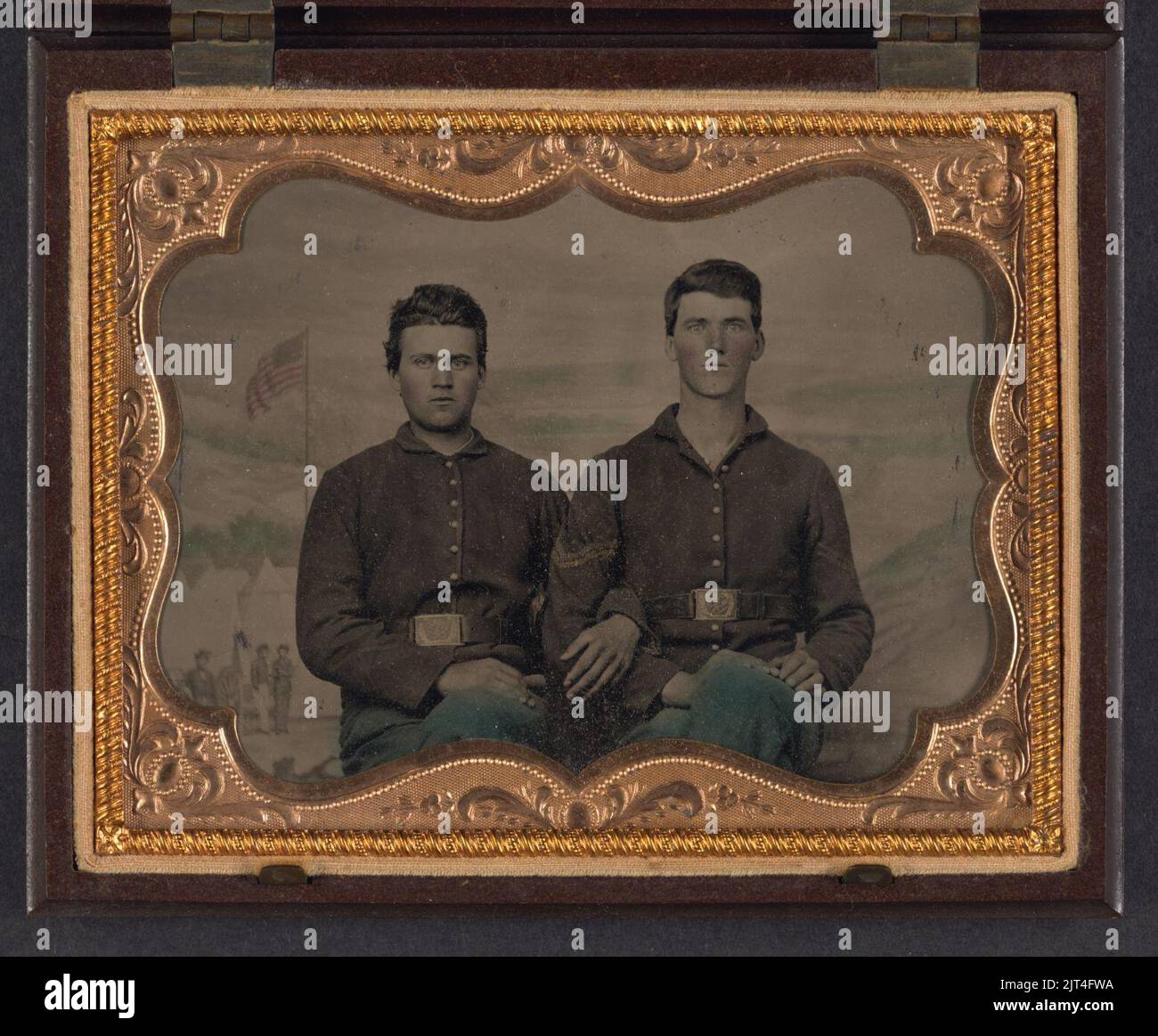 Two unidentified soldiers in Union uniforms in front of painted ...