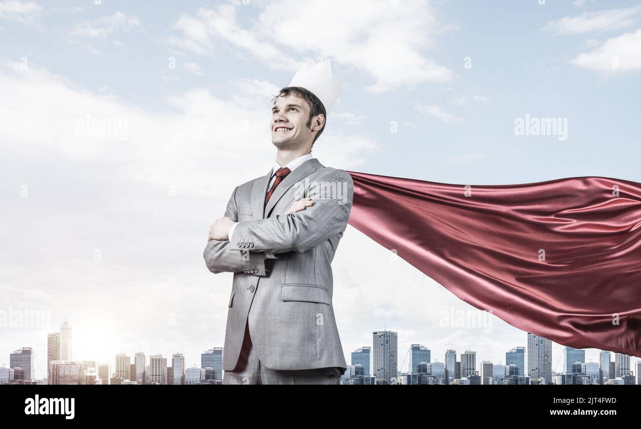 Concept of power and sucess with businessman superhero in big city ...