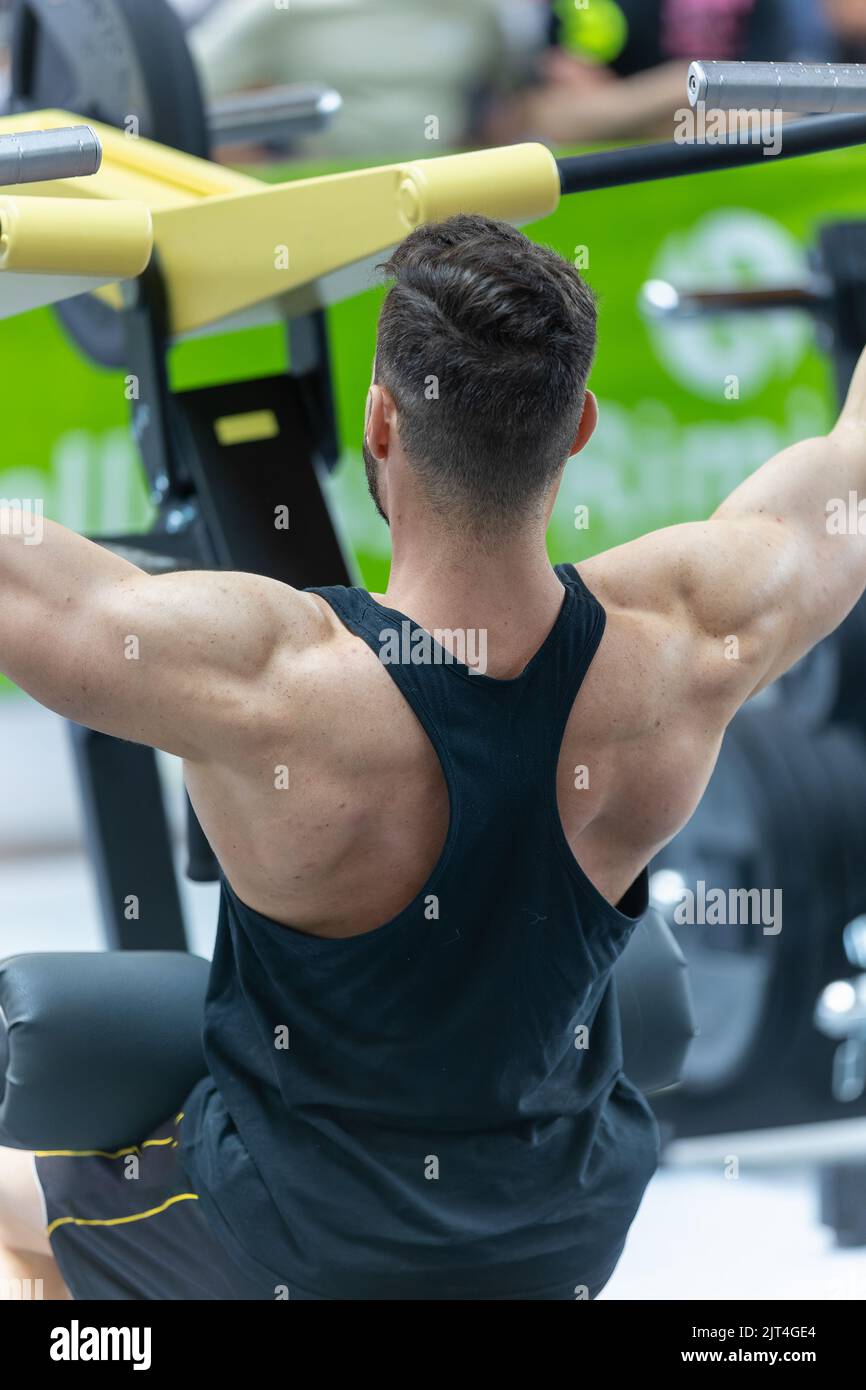 Fitness Workout: Boy doing Exercises in Class with Shoulder Gym ...