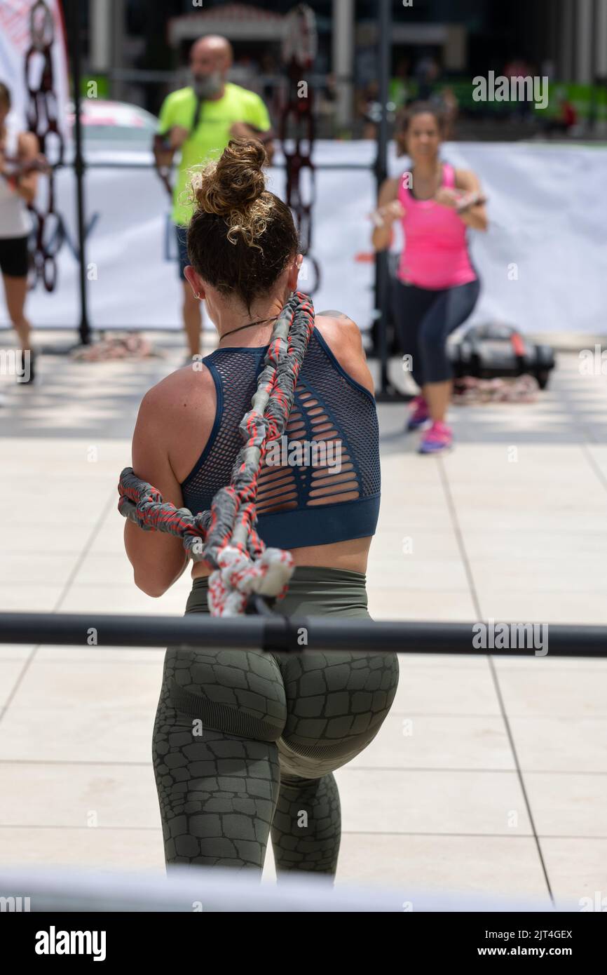Girl Having Fitness Workout with Rope in an Outdoor Gym Stock Photo - Alamy
