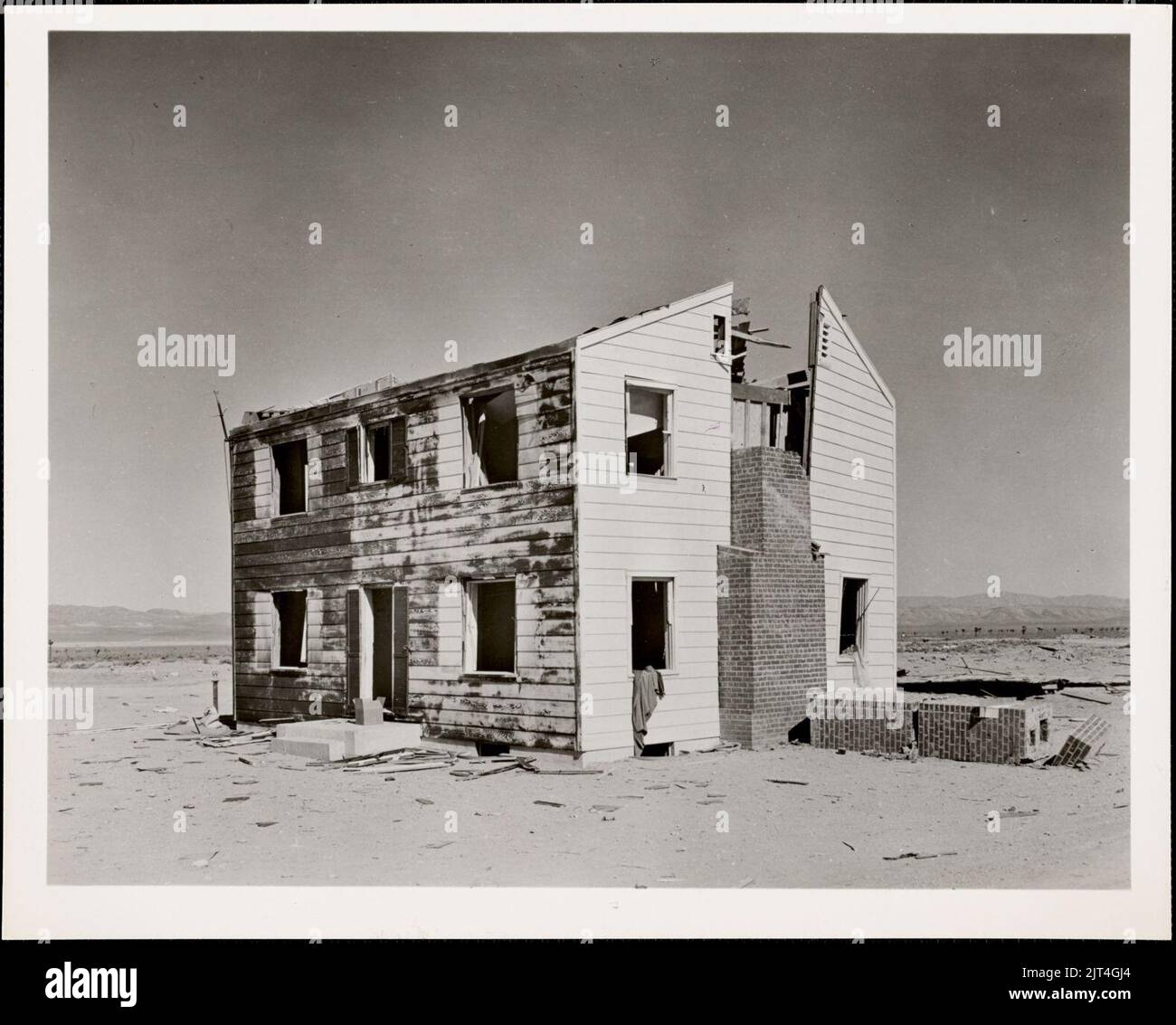Two-story frame house after blast, Welfare photos of Operation Cue ...