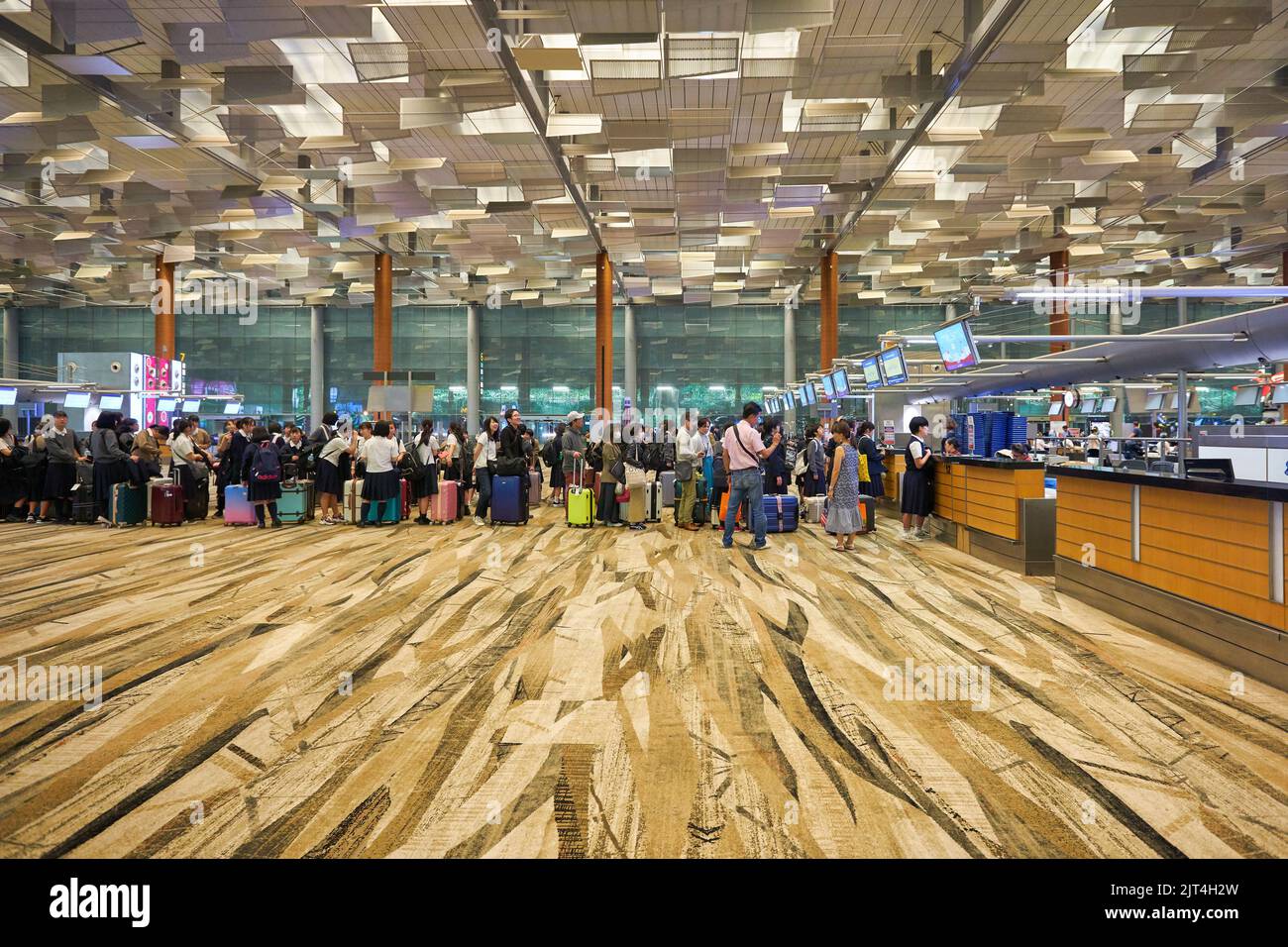 SINGAPORE - CIRCA JANUARY, 2020: people stand in line waiting for check ...