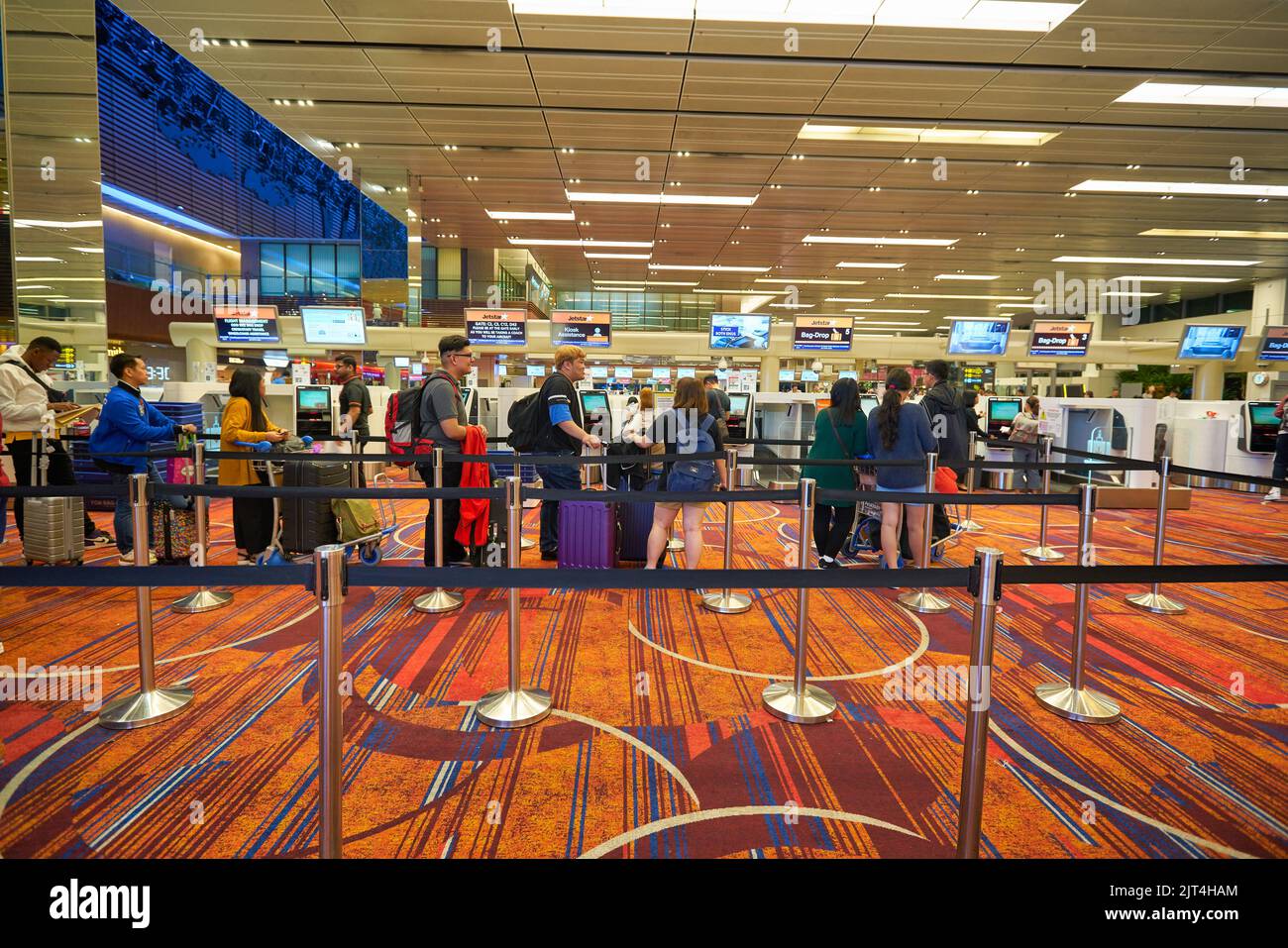 SINGAPORE - CIRCA JANUARY, 2020: people stand in line waiting for check ...