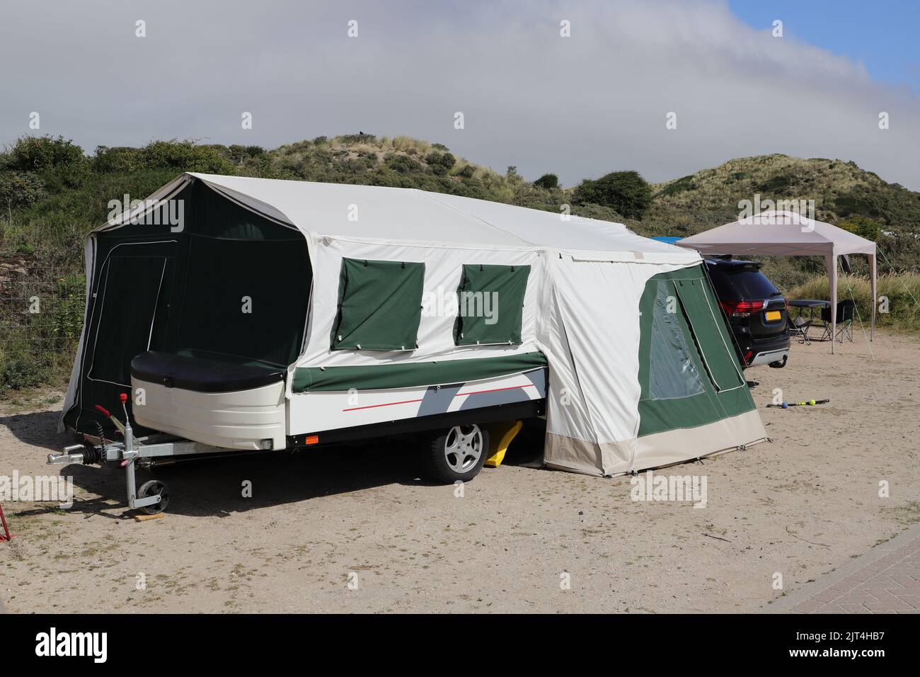 an old folding caravan on a campsite Stock Photo - Alamy