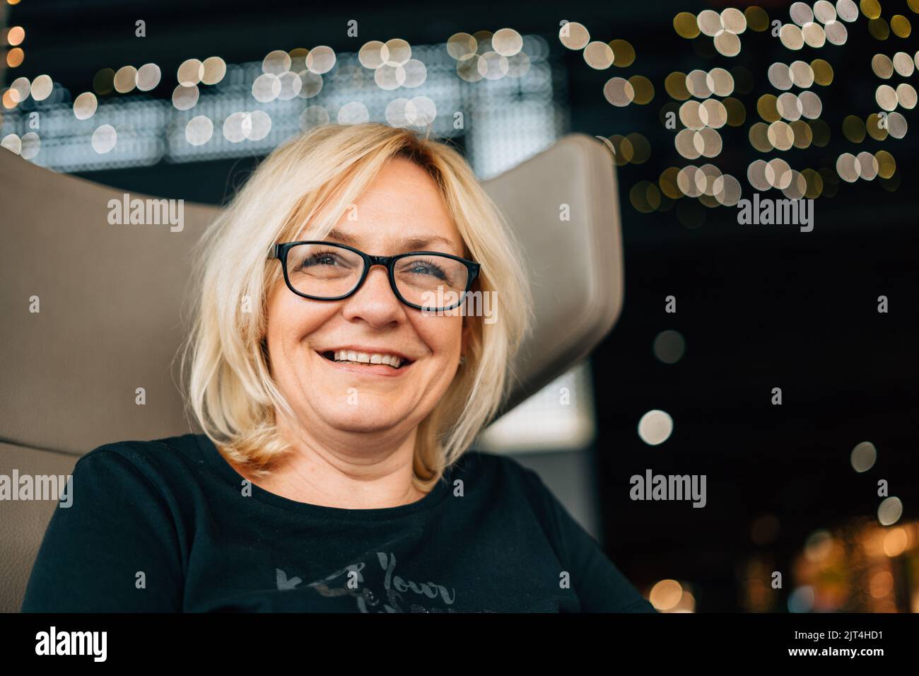 Blonde woman on restaurant terrace hi-res stock photography and images ...