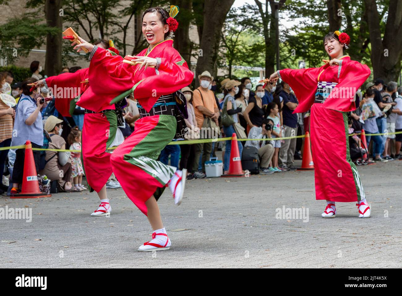 Tokyo, Japan. 27th Aug, 2022. Women wearing red kimono dance at the ...