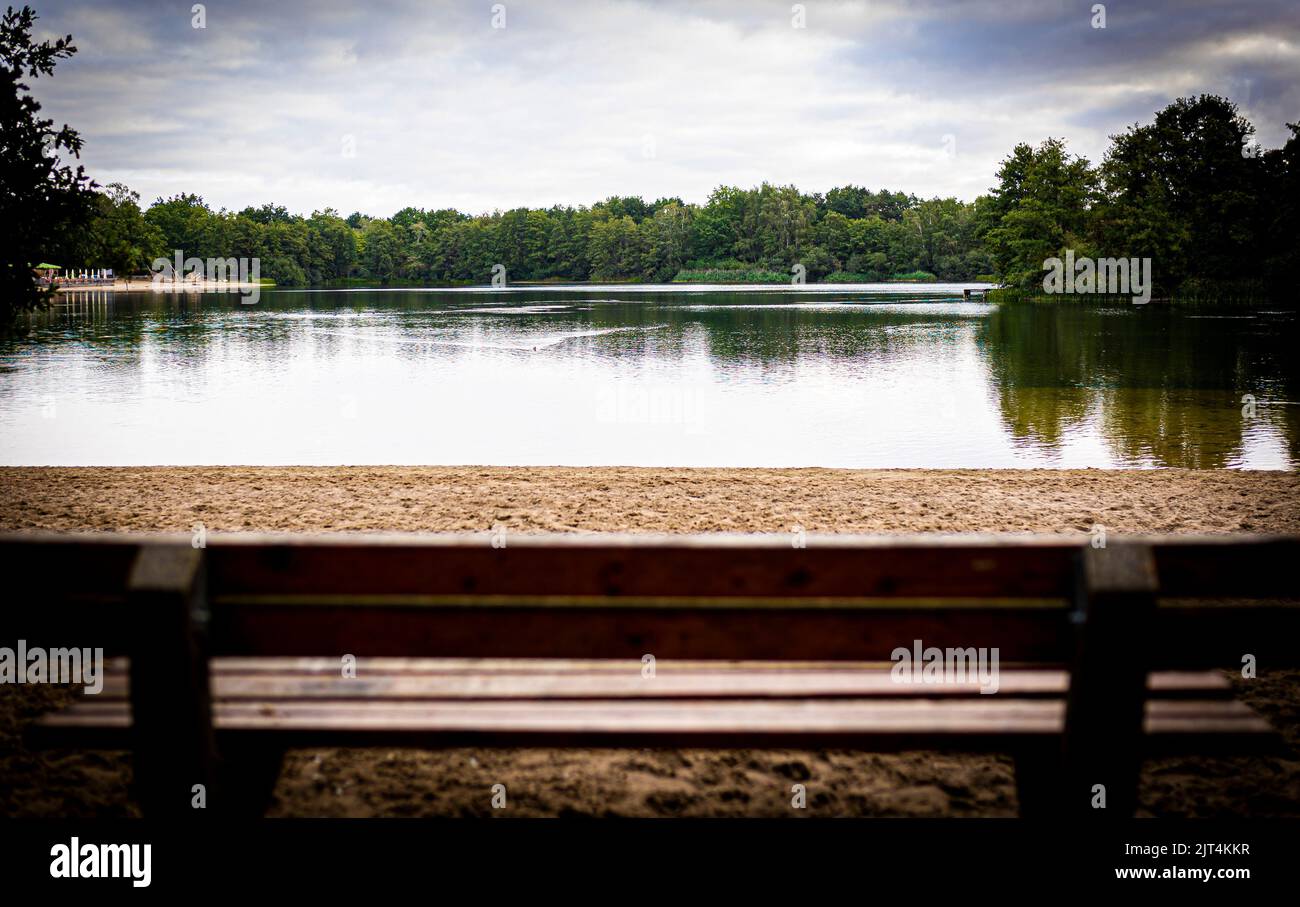 Langenhagen, Germany. 28th Aug, 2022. A bench stands in the morning ...