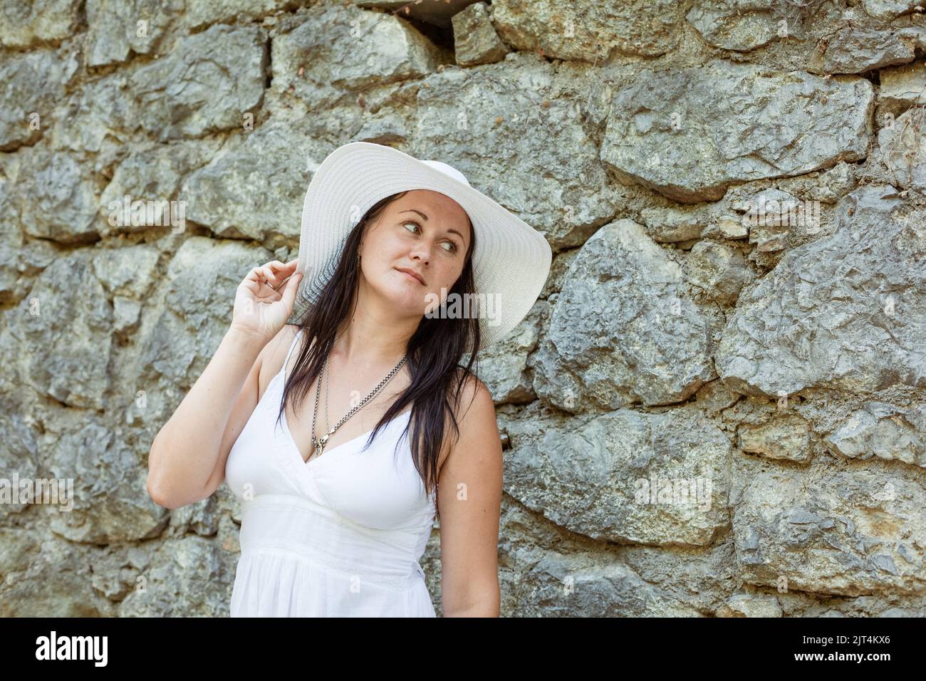 Happy cute brunette woman in park on summer day. Cheerful beautiful ...