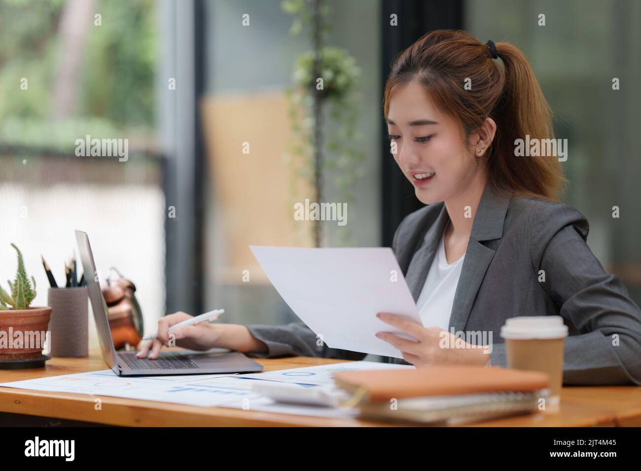 Modern business woman analysis financial paperwork document Stock Photo ...