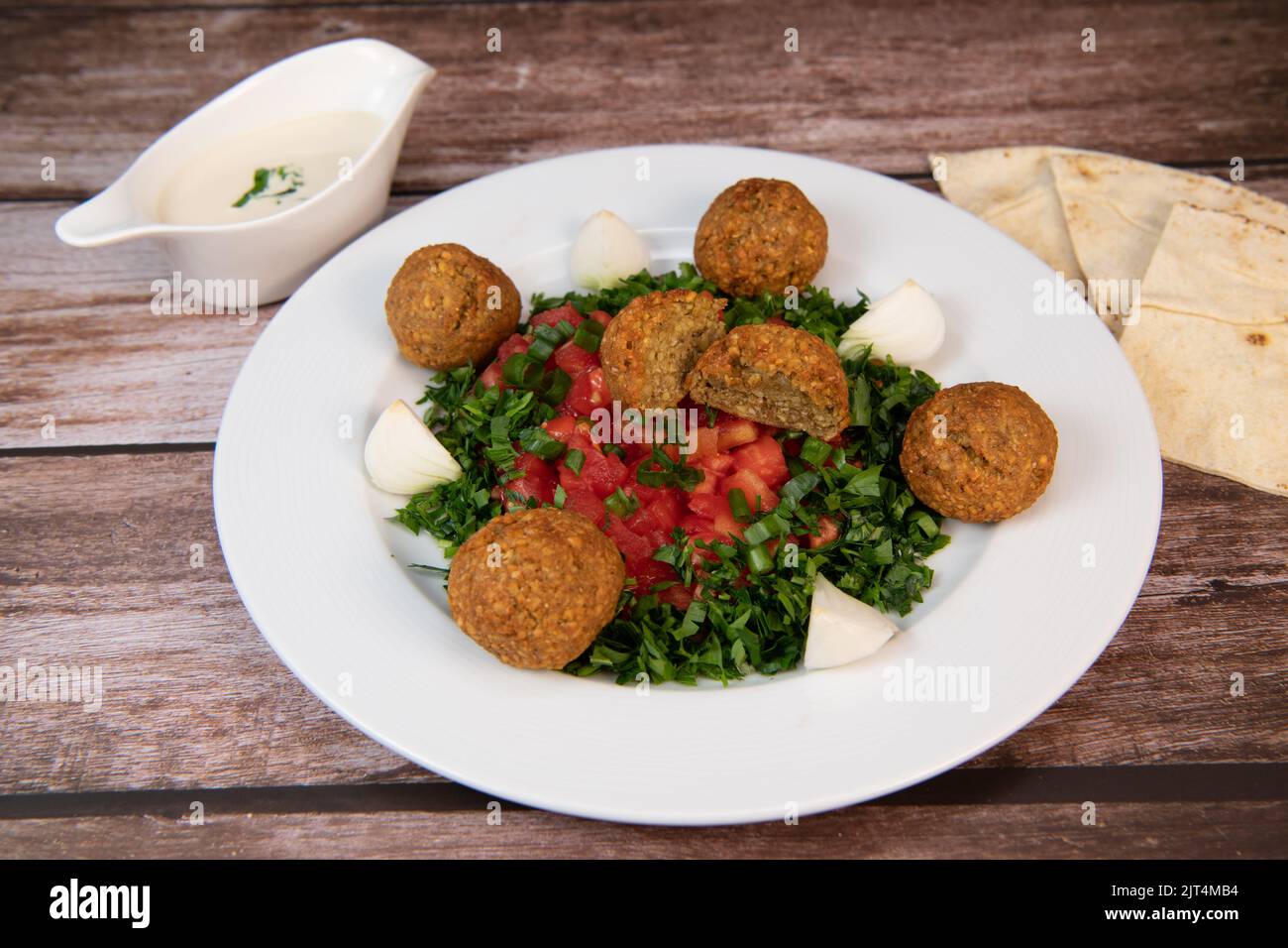 Vegetarian dish, falafel balls from spiced chickpeas with chopped ...