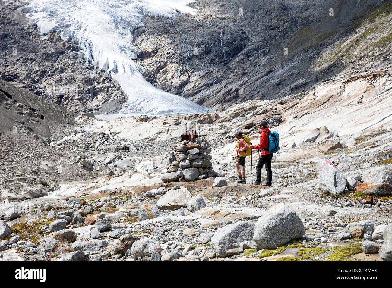 Mother and son standing near stone pyramid looking at the schlatenkees ...