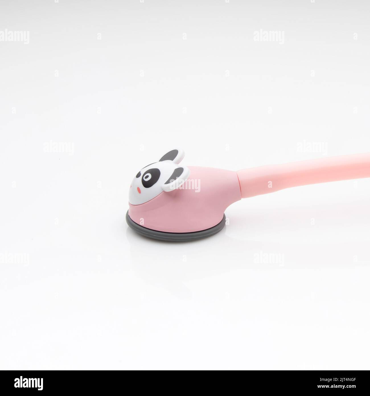 A pediatric stethoscope with interchangeable animal head on a white ...