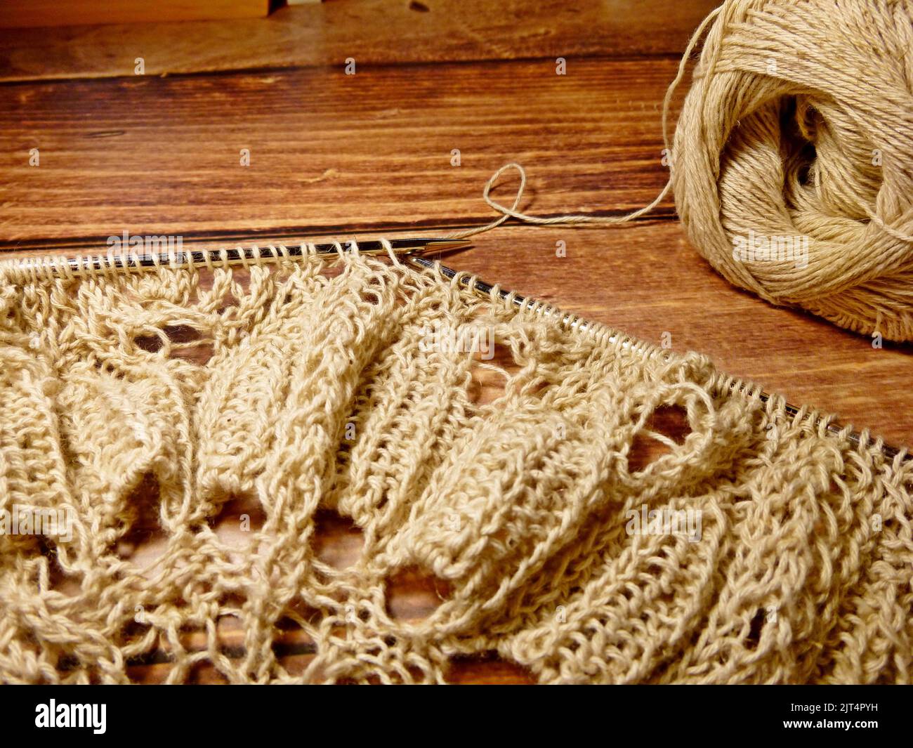 Process of knitting. Knitting needles, loops on knitting needles ...