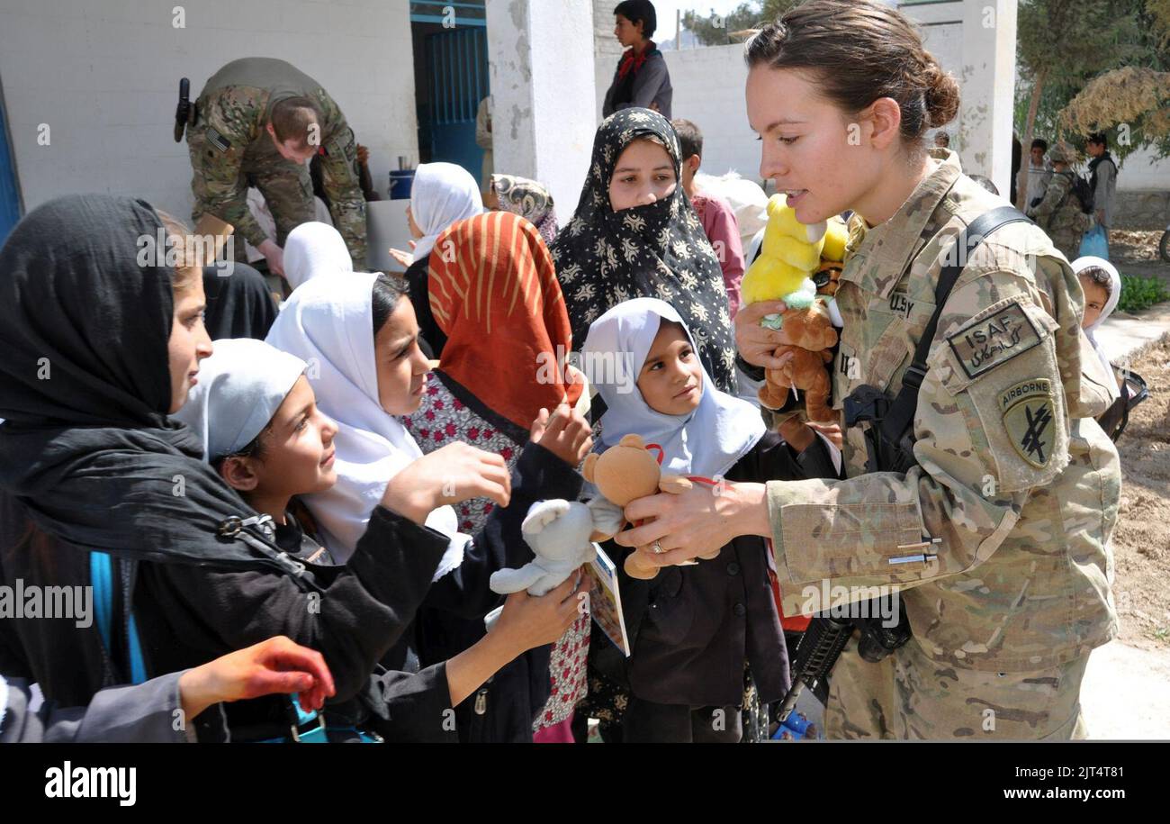 U.S. Army Capt. right, with a civil affairs team with the Farah Provincial Reconstruction Team ...